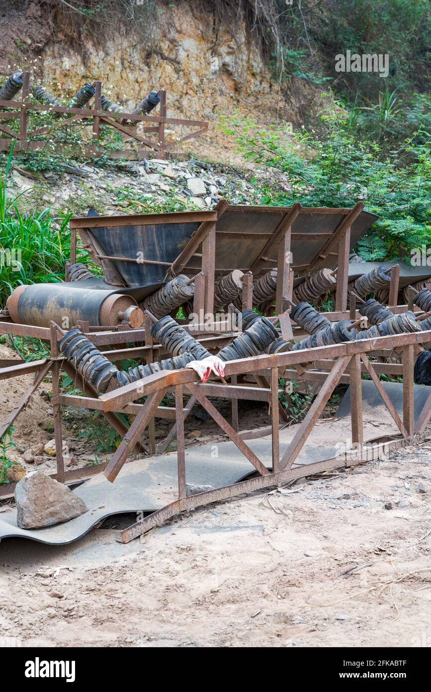 Close-up of sand mining equipment by the river beach Stock Photo - Alamy