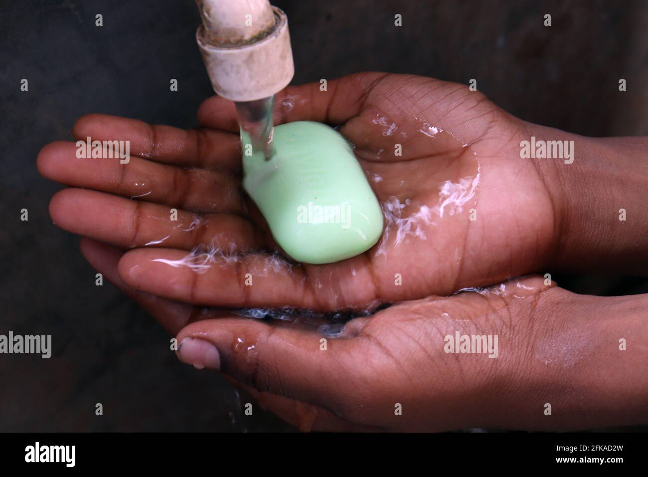soap with water splash on hand for wash Stock Photo - Alamy