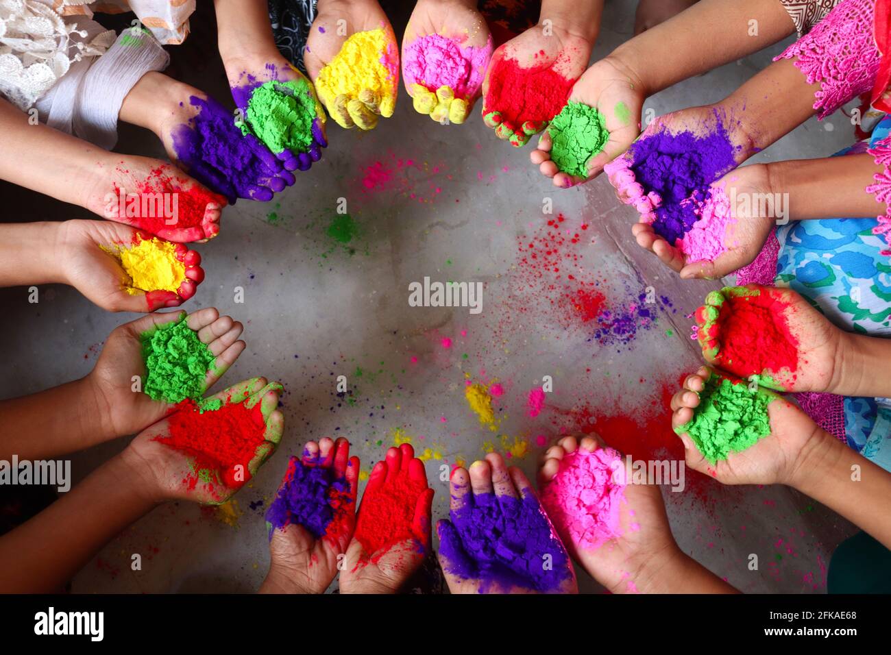 multiple colored powder on hands for holiday Stock Photo - Alamy