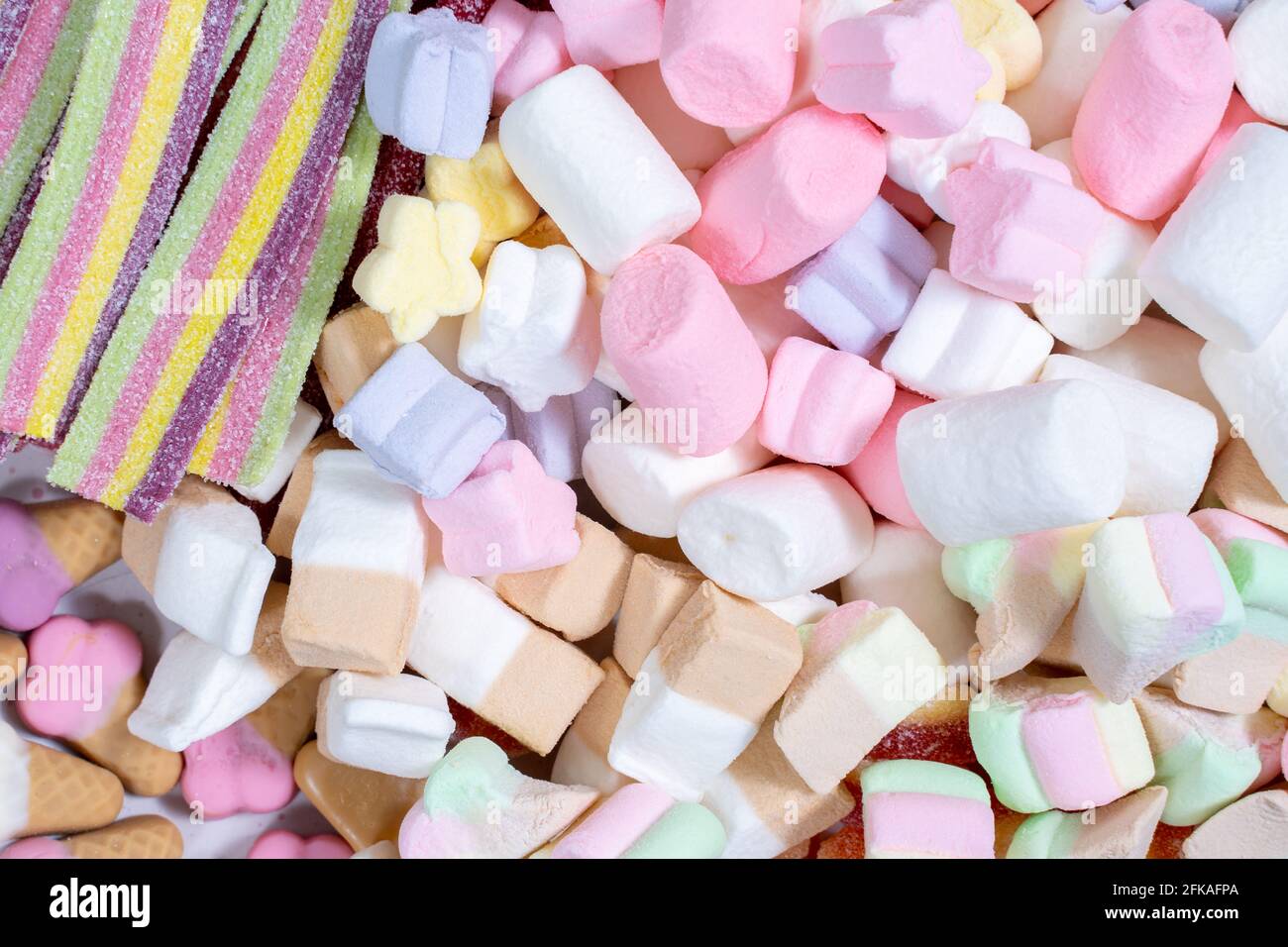 a lot of sweet snacks. candy background Stock Photo - Alamy