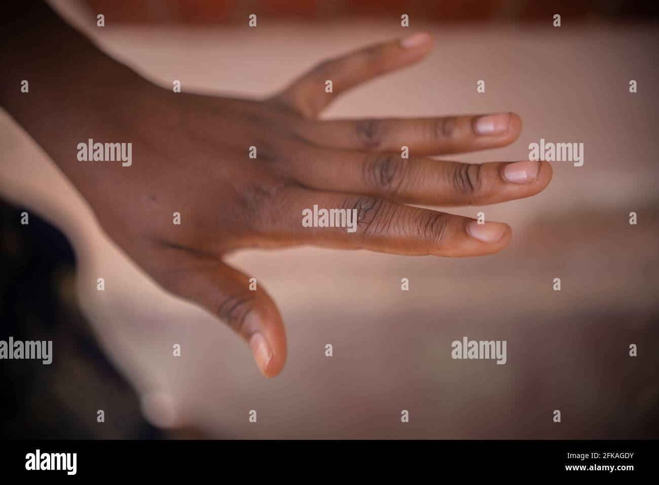 Zambian, African woman hand, sign of, peace, love, relationship ...