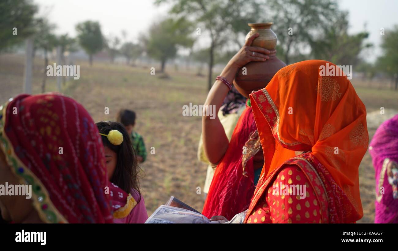 Hindu religion concept. Many religious women holding sacred pot to ...