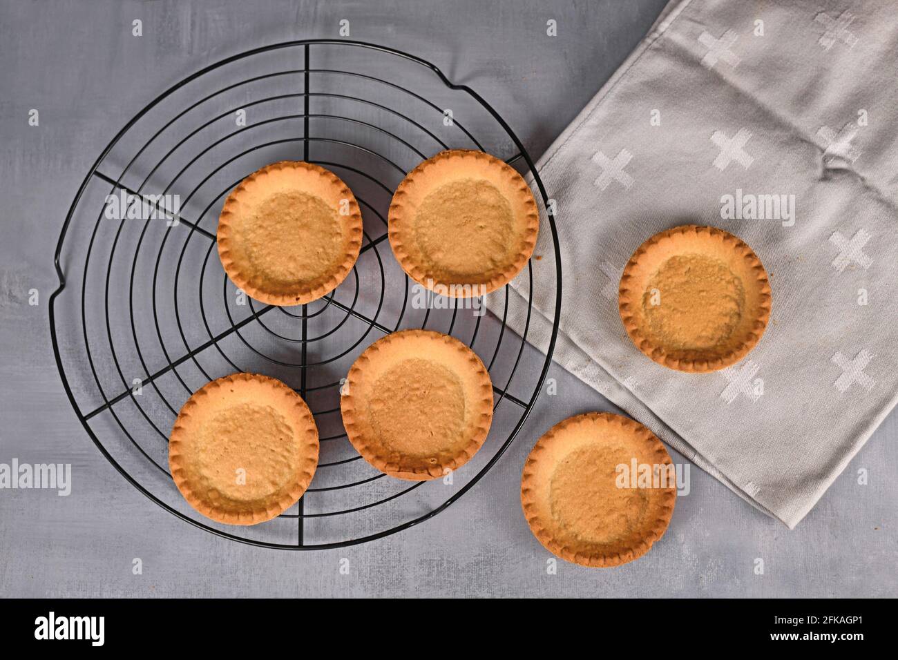 Homemade small tartlet pastry crusts without filling Stock Photo - Alamy