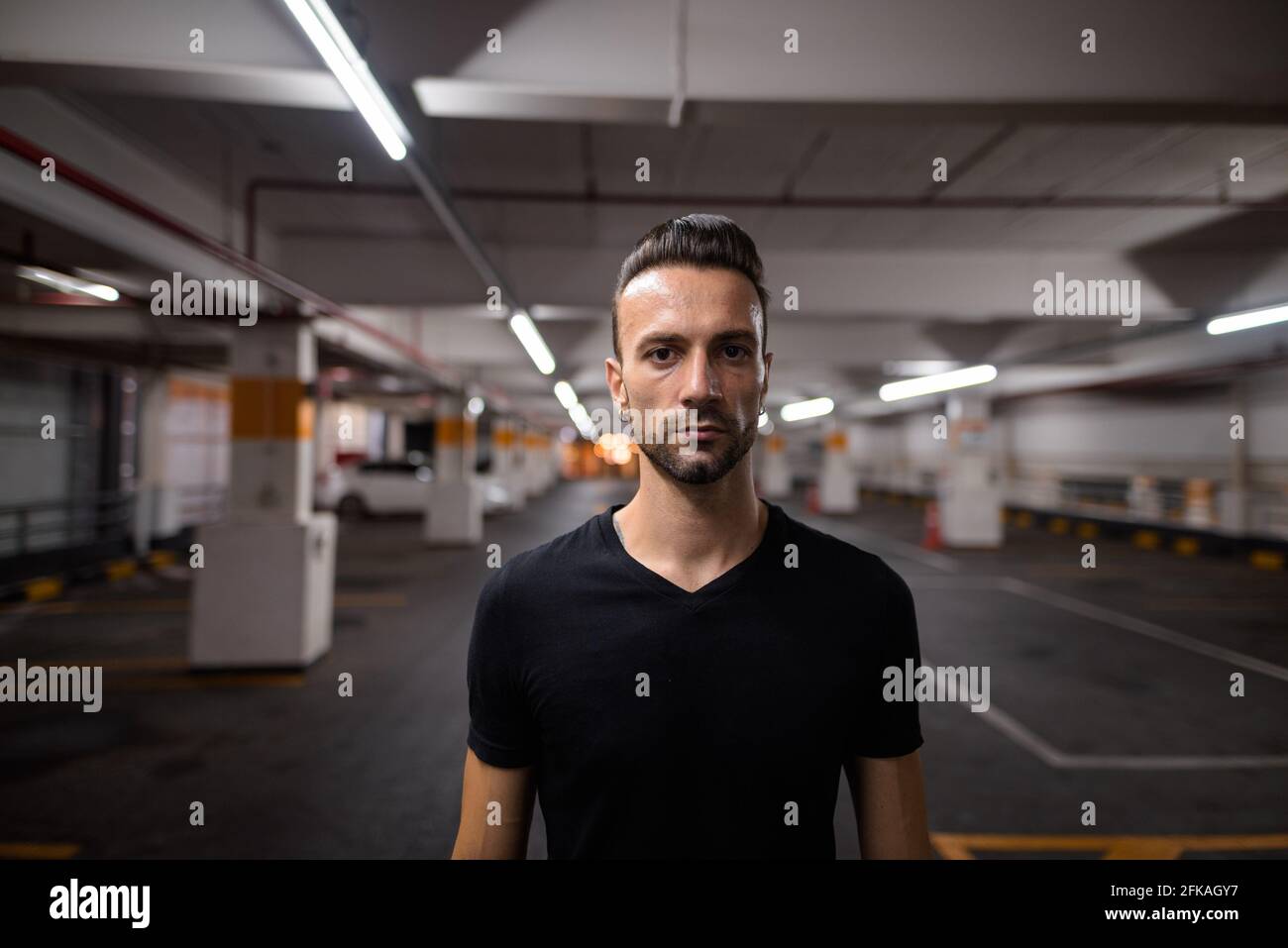 Portrait of handsome man at night at parking lot Stock Photo - Alamy