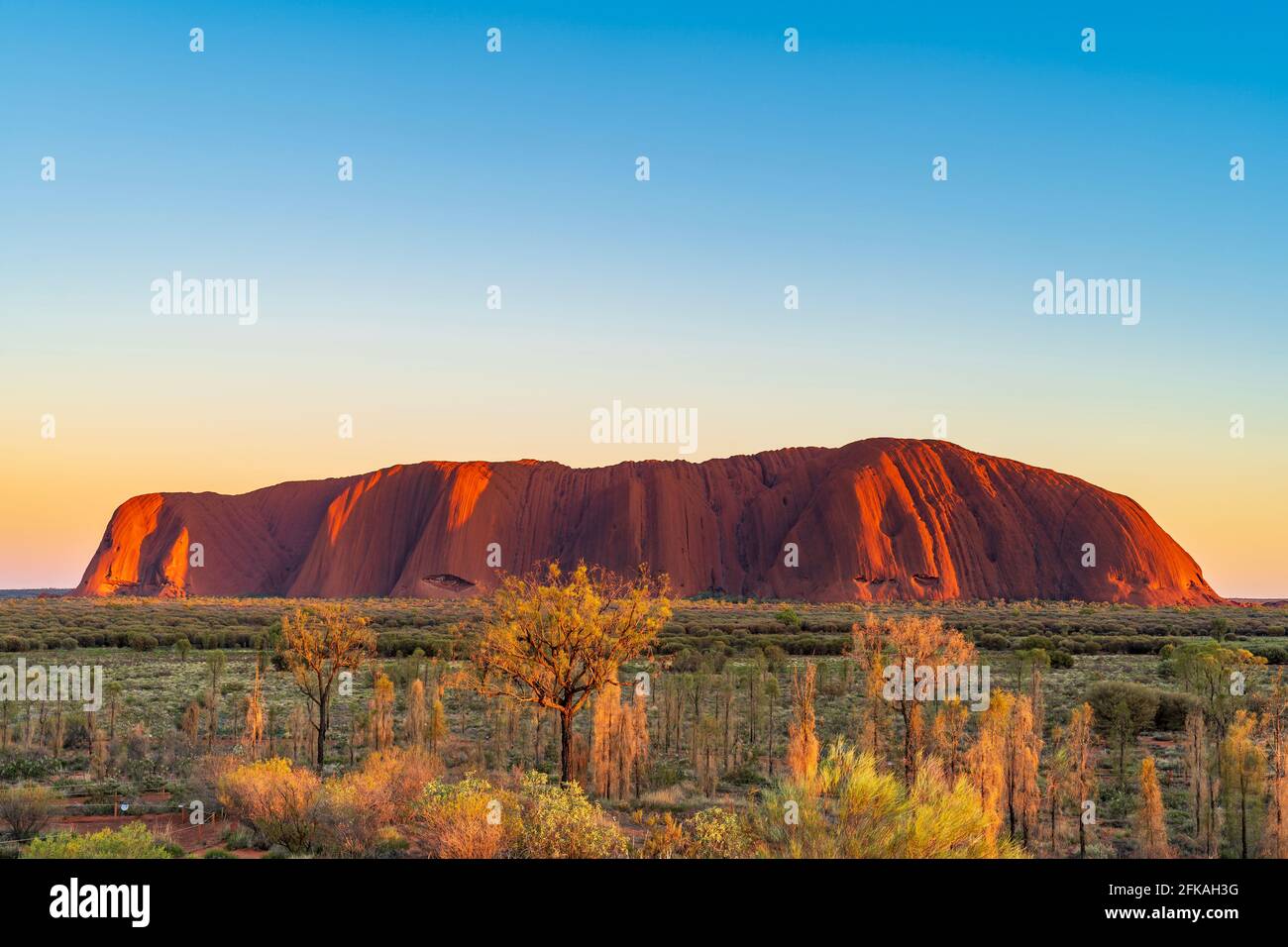 Uluru at sunrise Stock Photo - Alamy