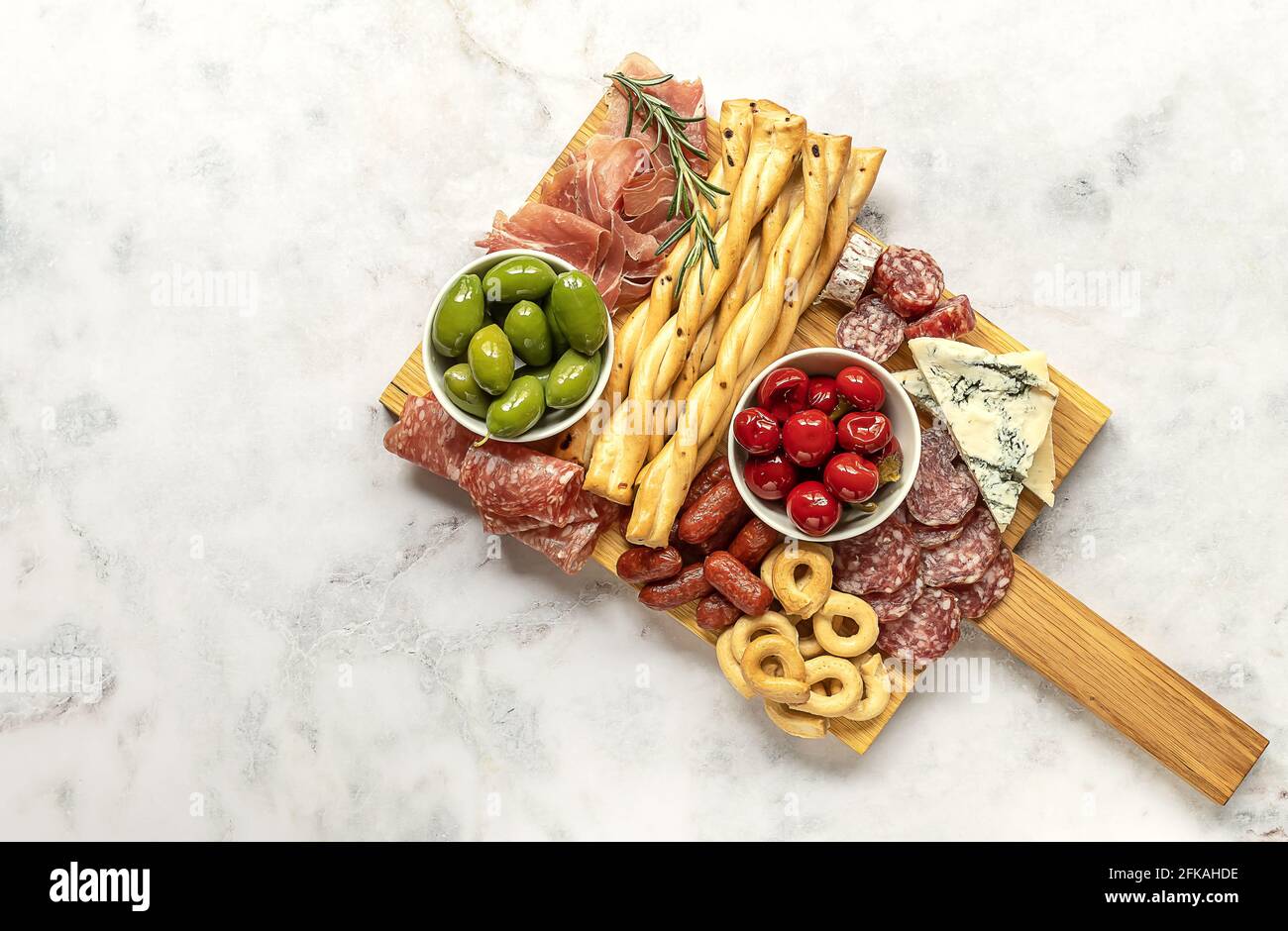 Appetizers board with assorted italian snacks. Cheese, meat, olives ...