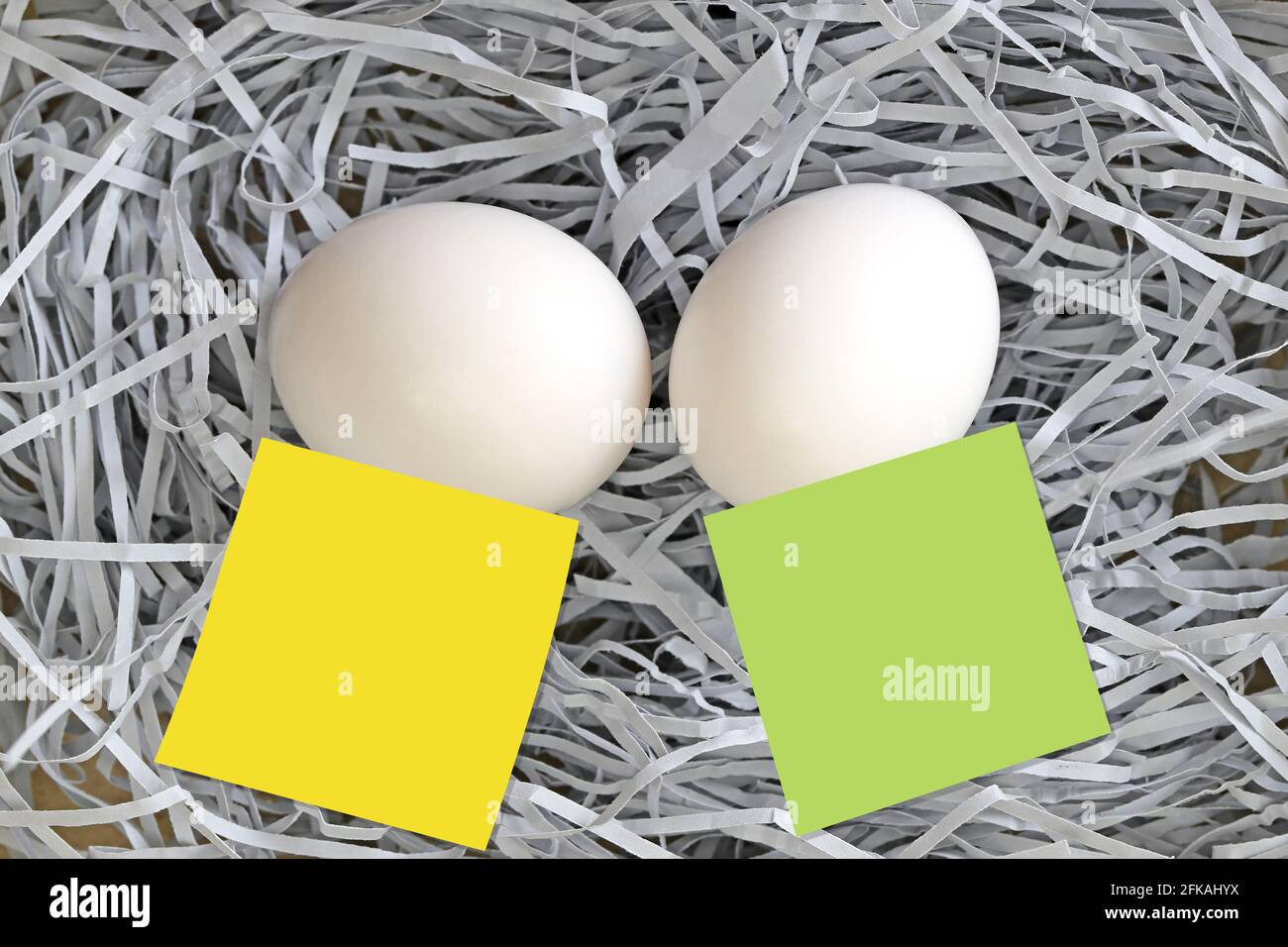 Fresh white eggs on paper hay with blank sticky note on them Stock ...