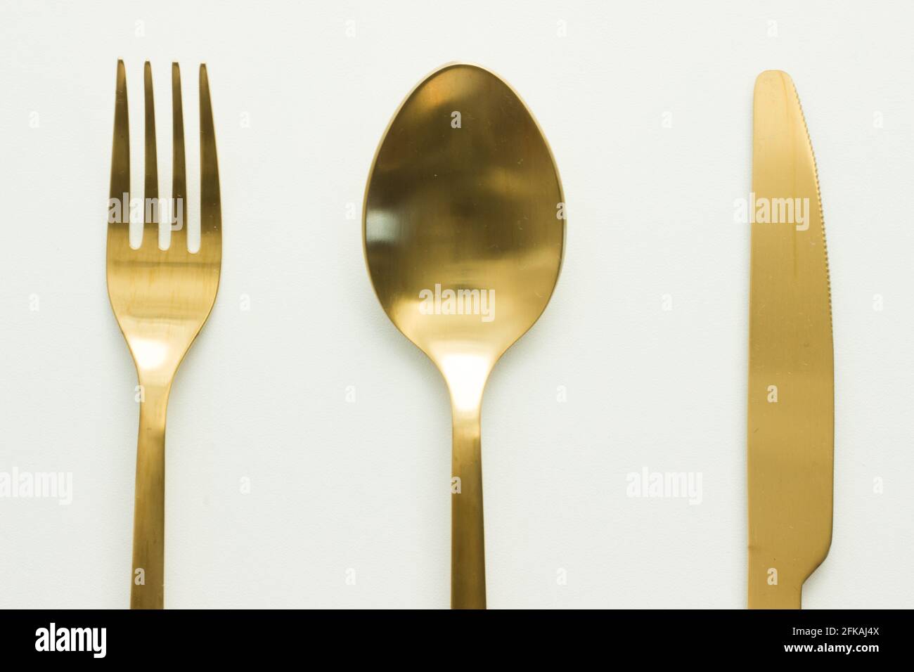 Cutlery golden spoon hi-res stock photography and images - Alamy