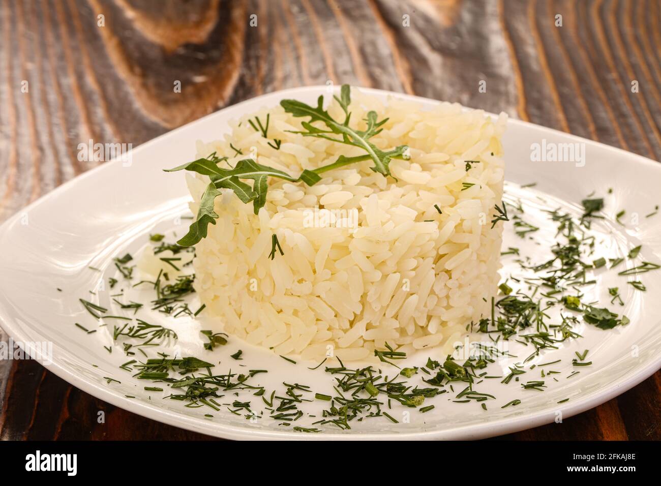 Steamed rice served green herbs in the plate Stock Photo - Alamy