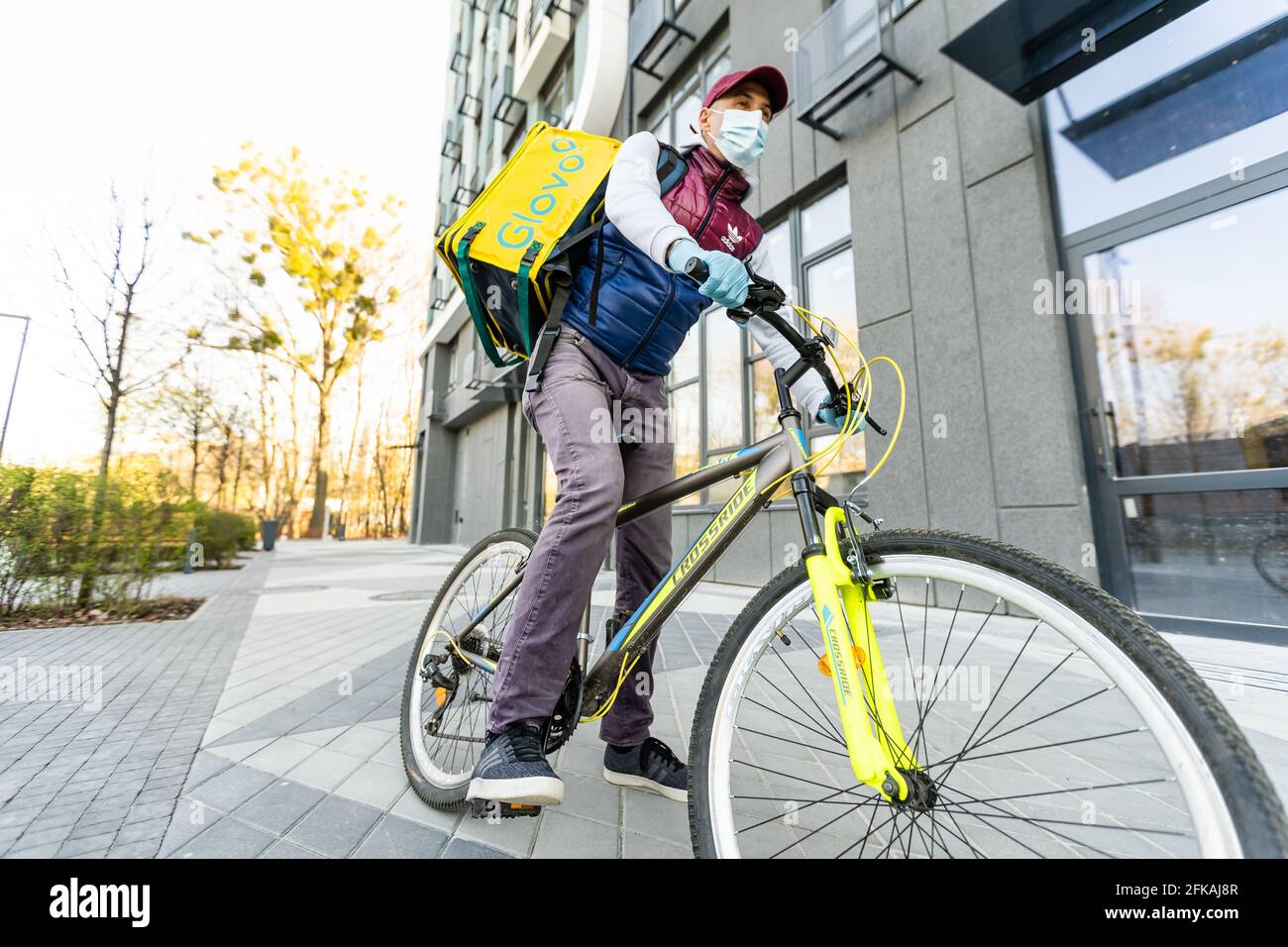 KIEV, UKRAINE - April 28, 2021: Glovo bike courier on the street ...