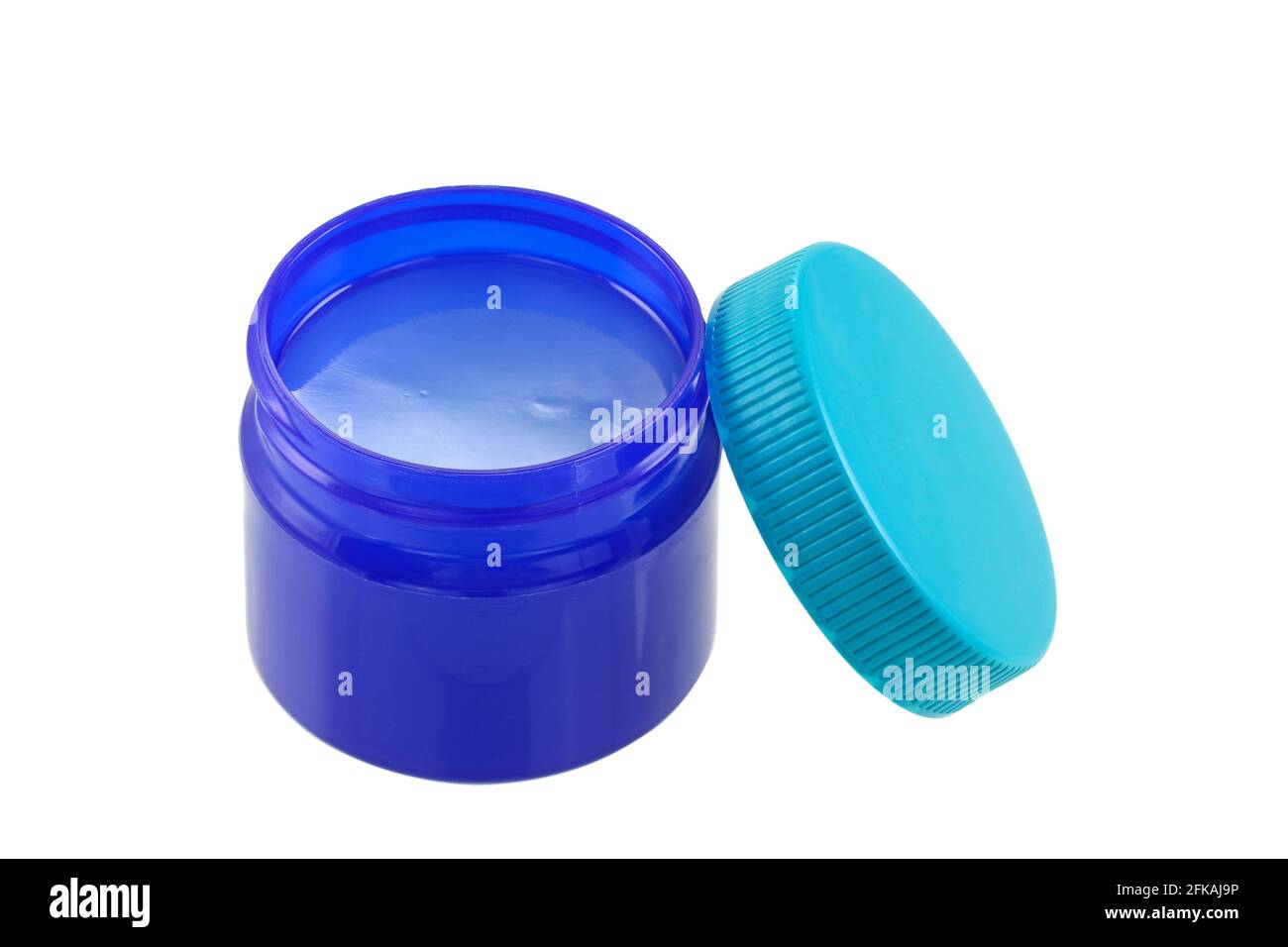 A small blue green jar full of mentholated topical ointment isolated on ...