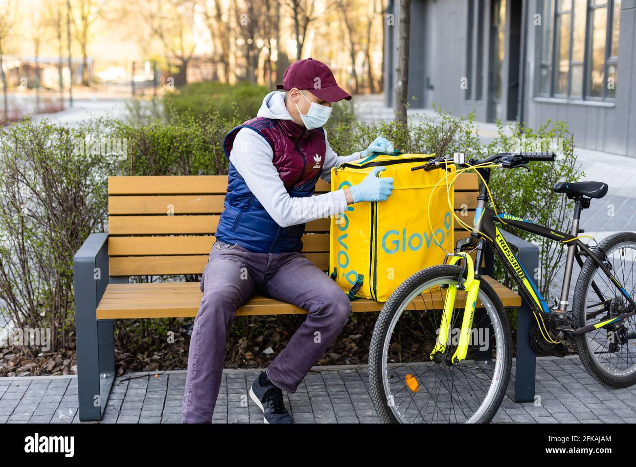 KIEV, UKRAINE - April 28, 2021: Glovo bike courier on the street ...