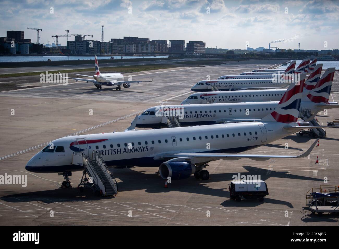 A line of British Airways planes at London City Airport, which has ...