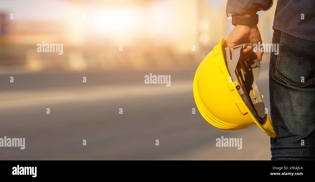 Engineer holding helmet on site Road construction For the development ...