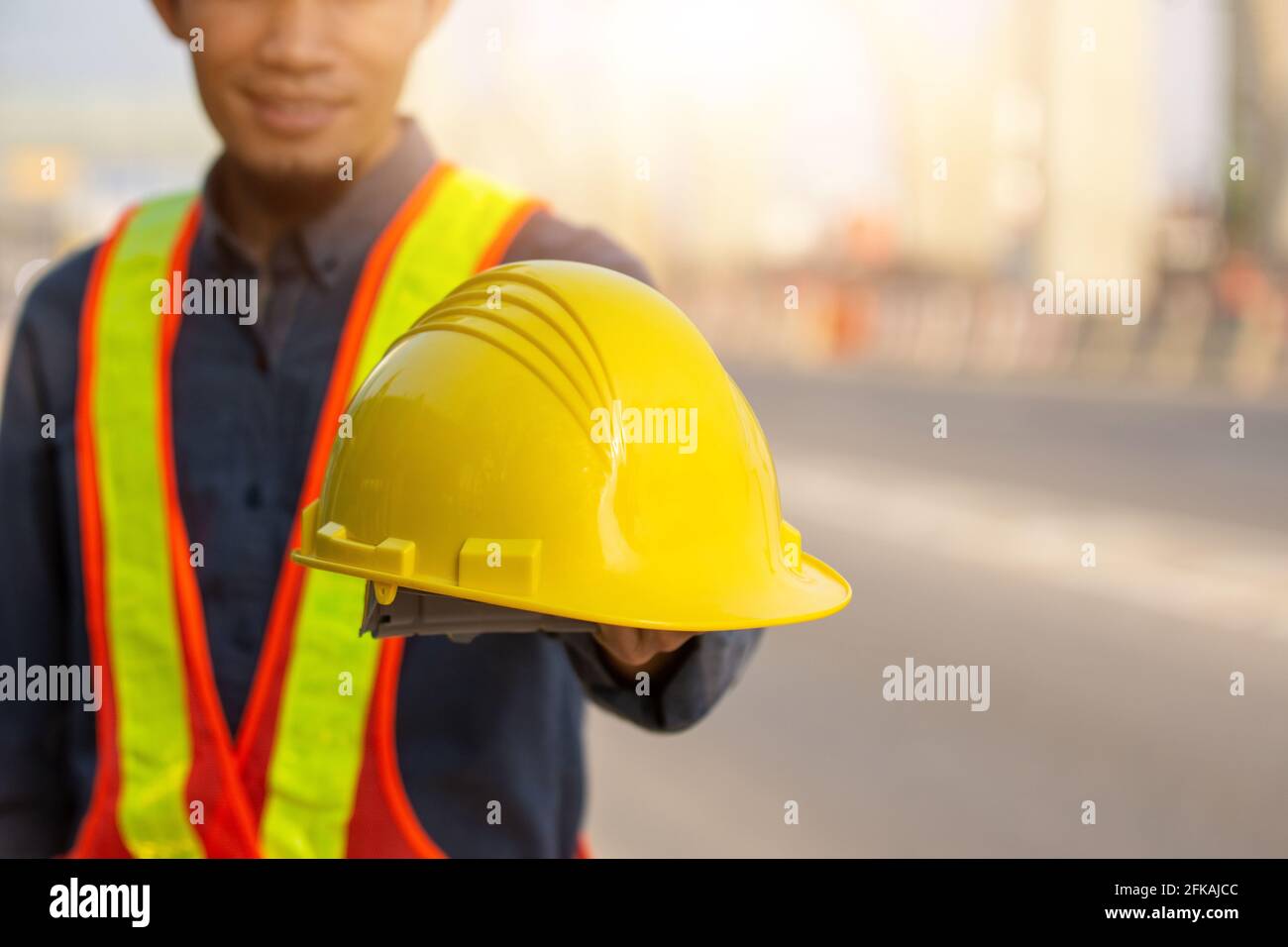 Engineer holding helmet on site Road construction For the development ...