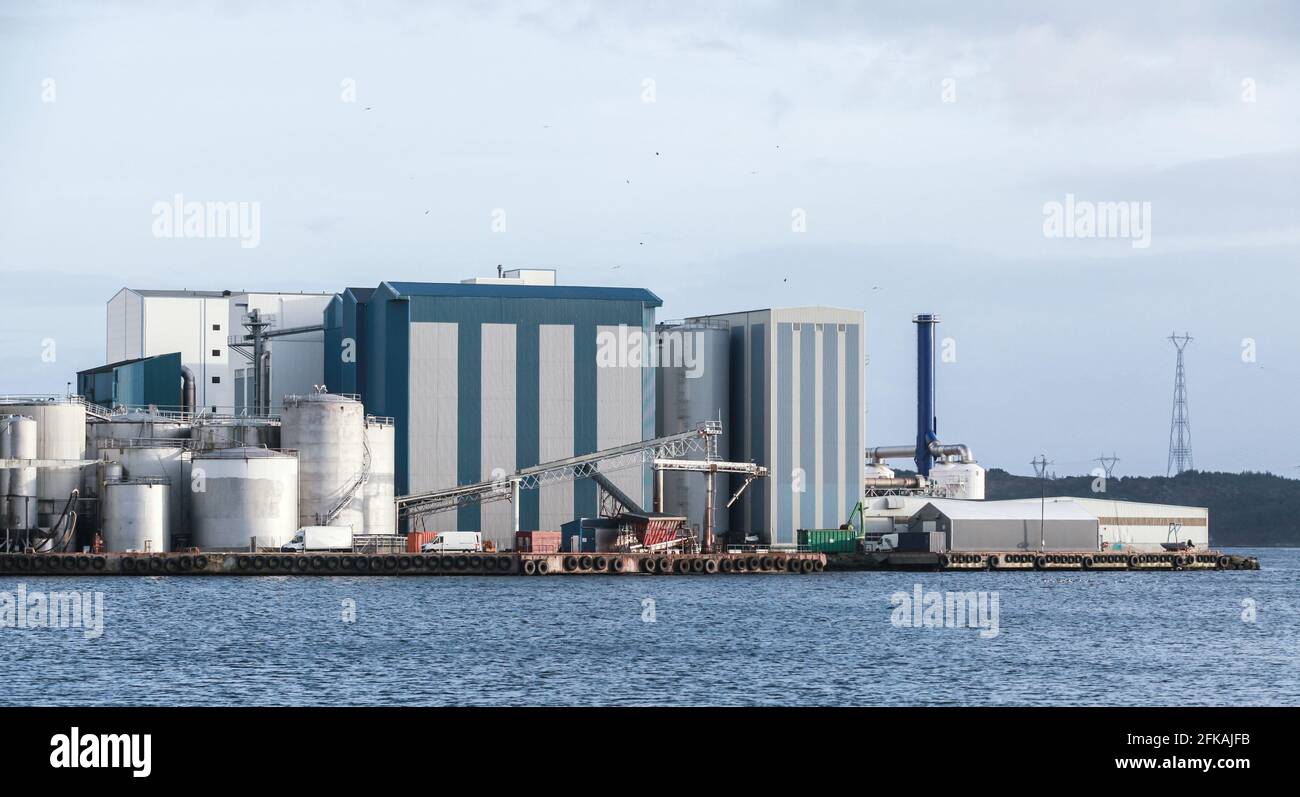 Norwegian fish factory, industrial buildings and tanks stand on a ...