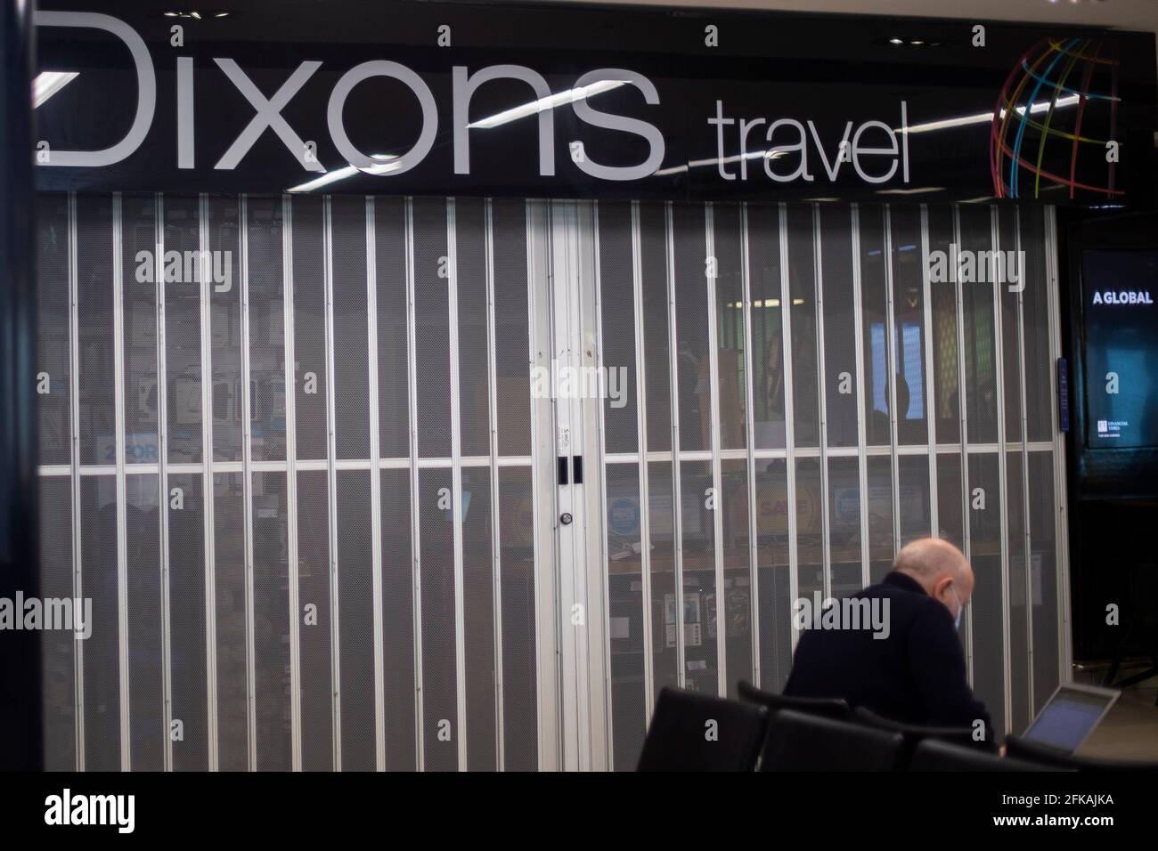 A Dixons Travel store with its shutters down at London City Airport ...