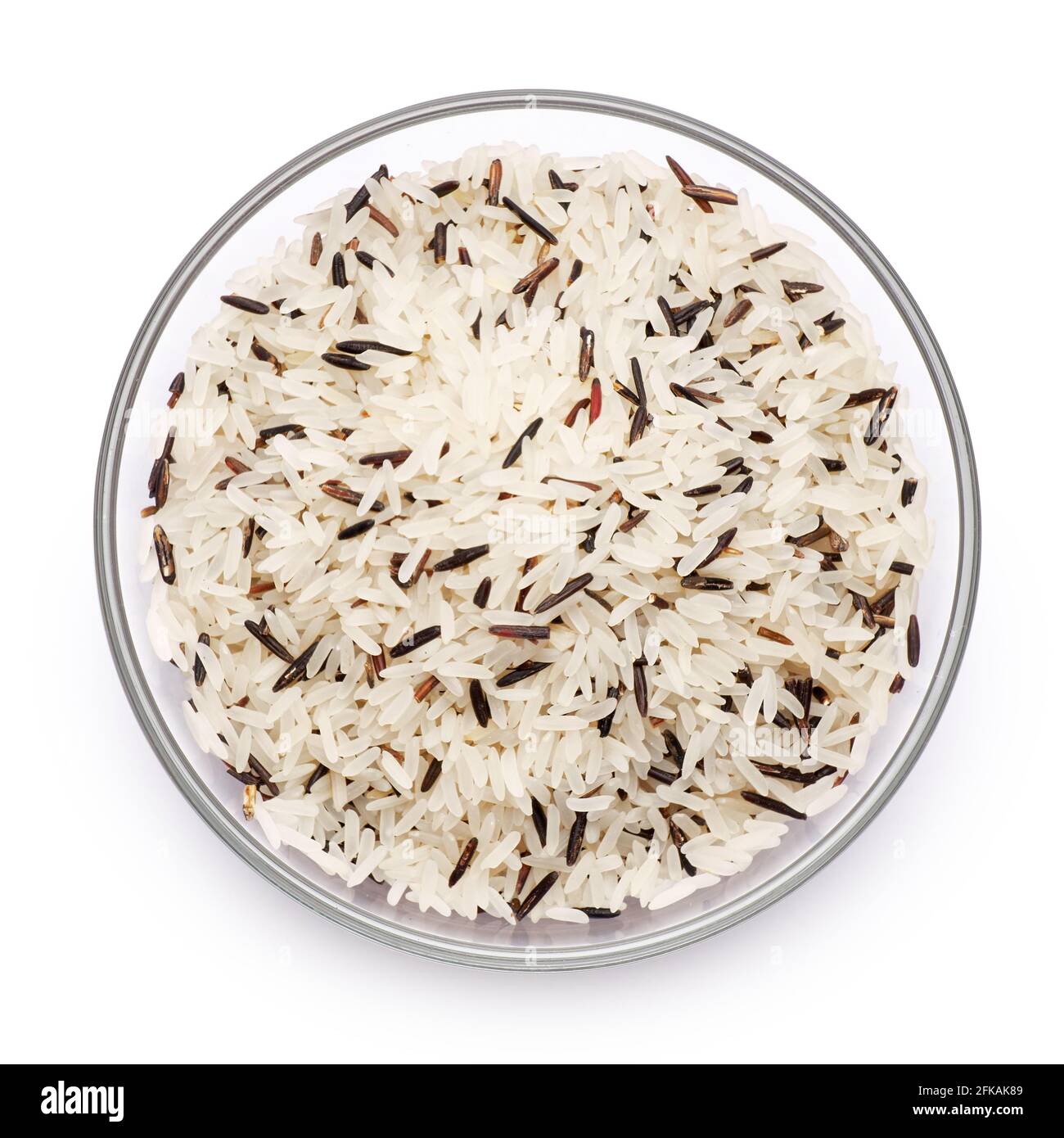 Raw Rice in a glass bowl isolated on a white background with clipping ...