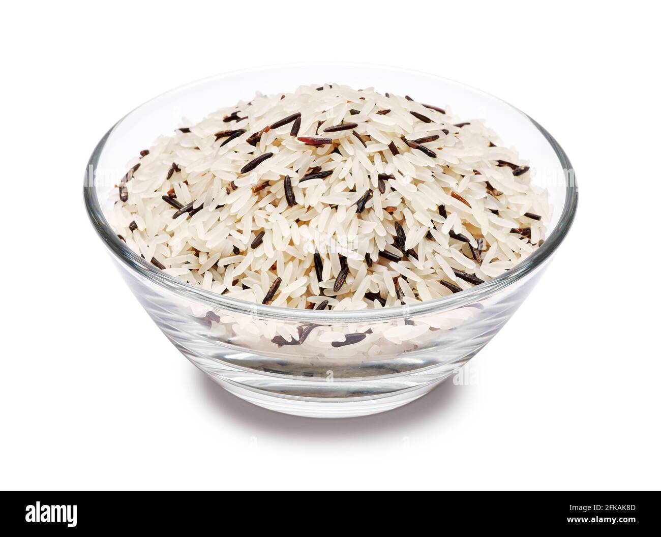 Raw Rice in a glass bowl isolated on a white background with clipping ...