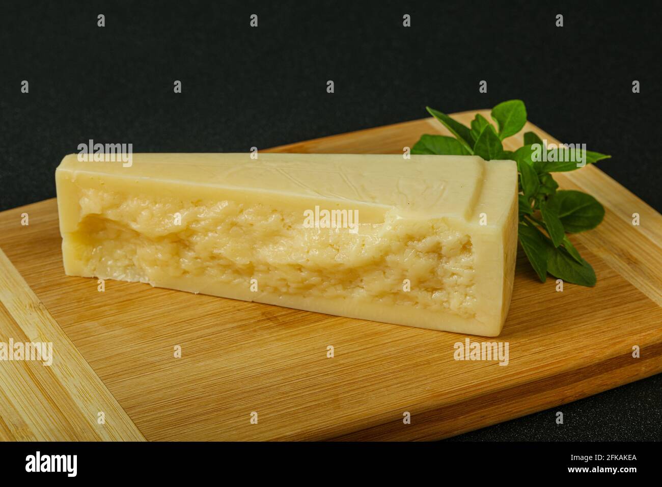 Hard parmesan cheese served basil leaves Stock Photo - Alamy