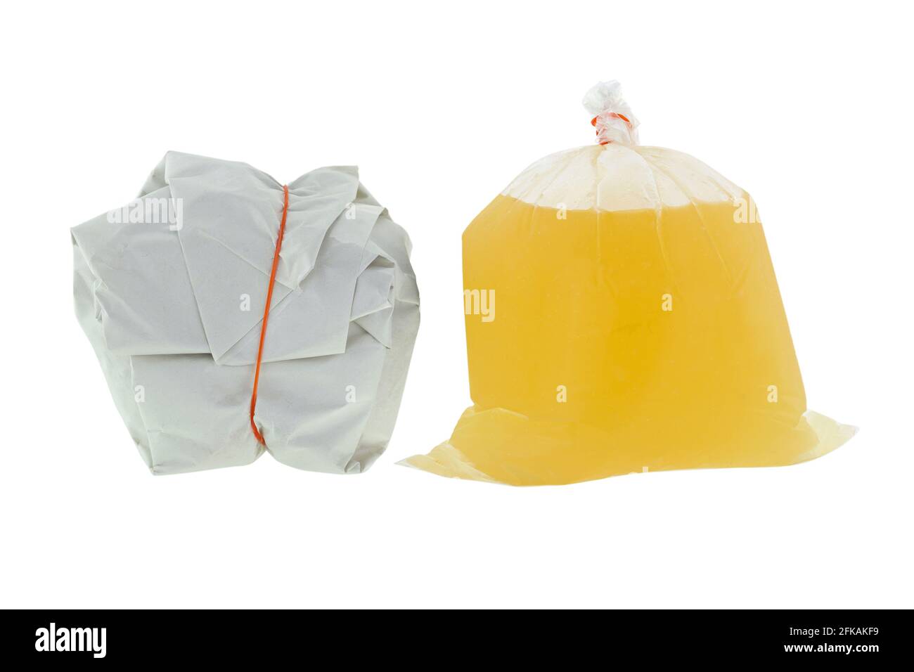 Takeout Thai Food wrapped in white paper package with red rubber band ...