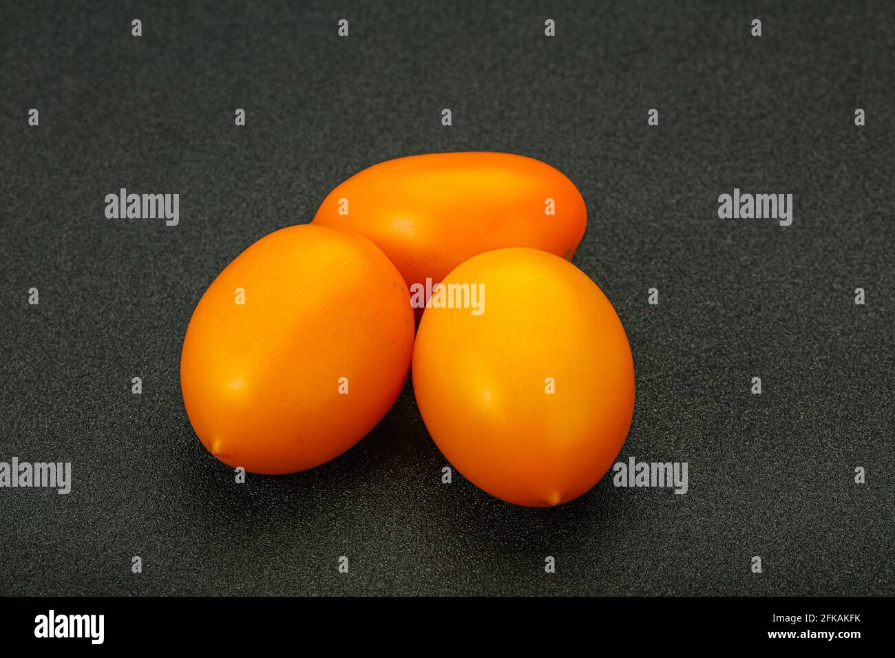 Few Yellow ripe tasty tomatoes vegetables Stock Photo - Alamy