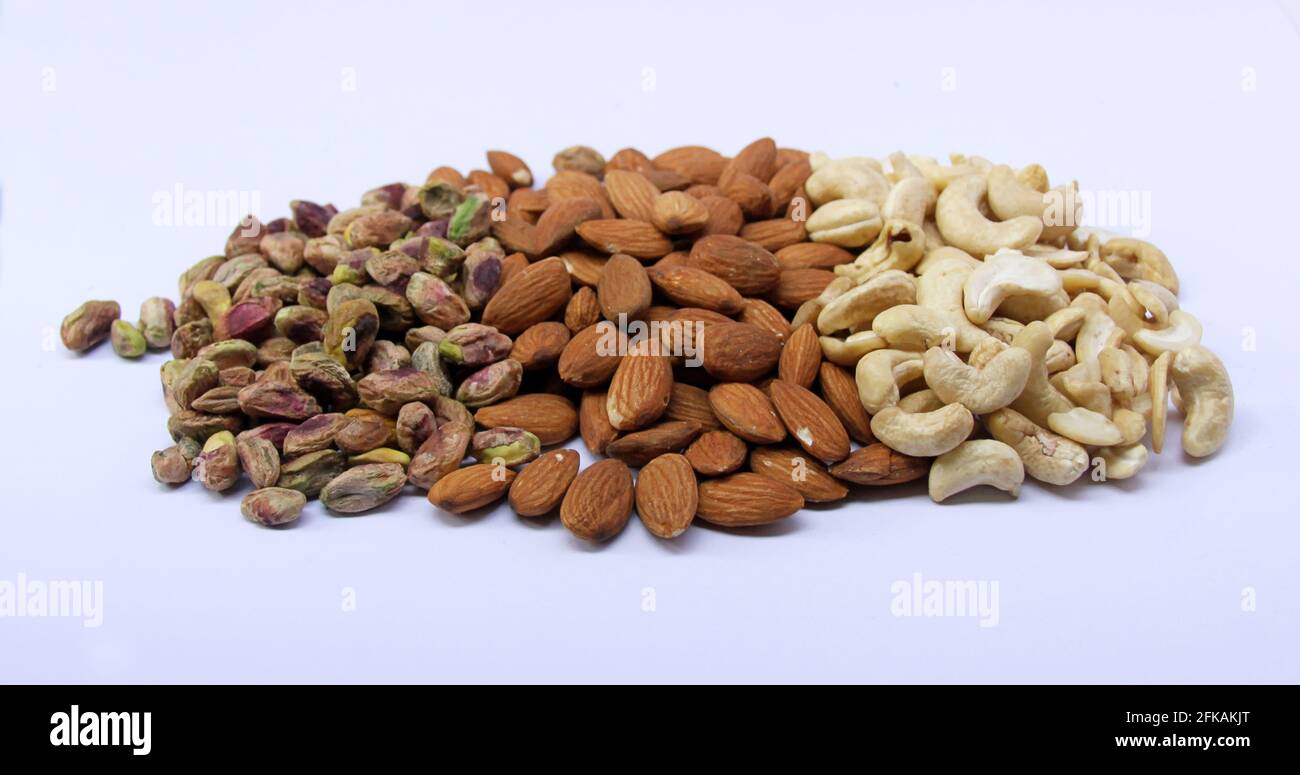 Mixed of almonds seeds nut on white background Stock Photo - Alamy