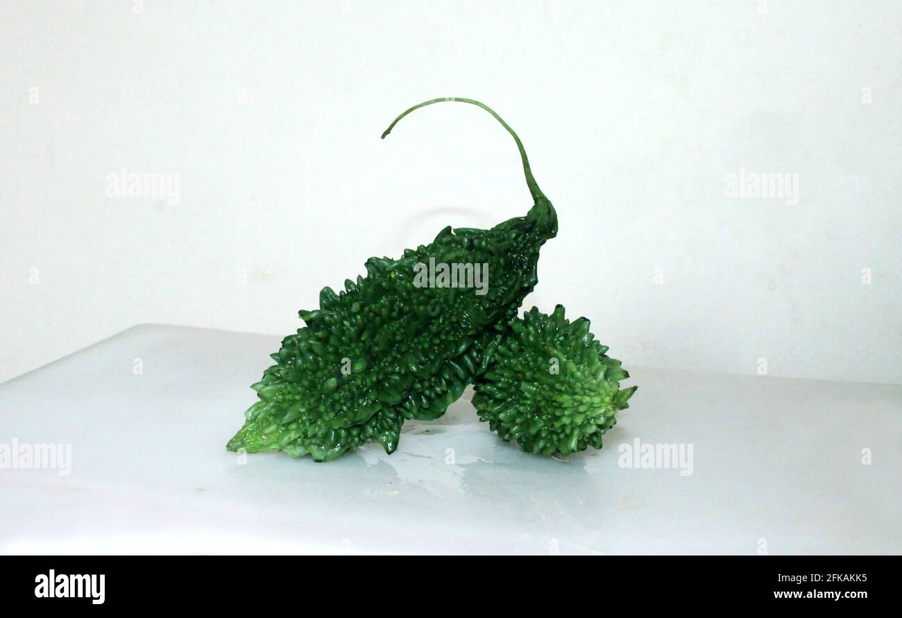 Fresh bitter gourd isolated on white background Stock Photo - Alamy