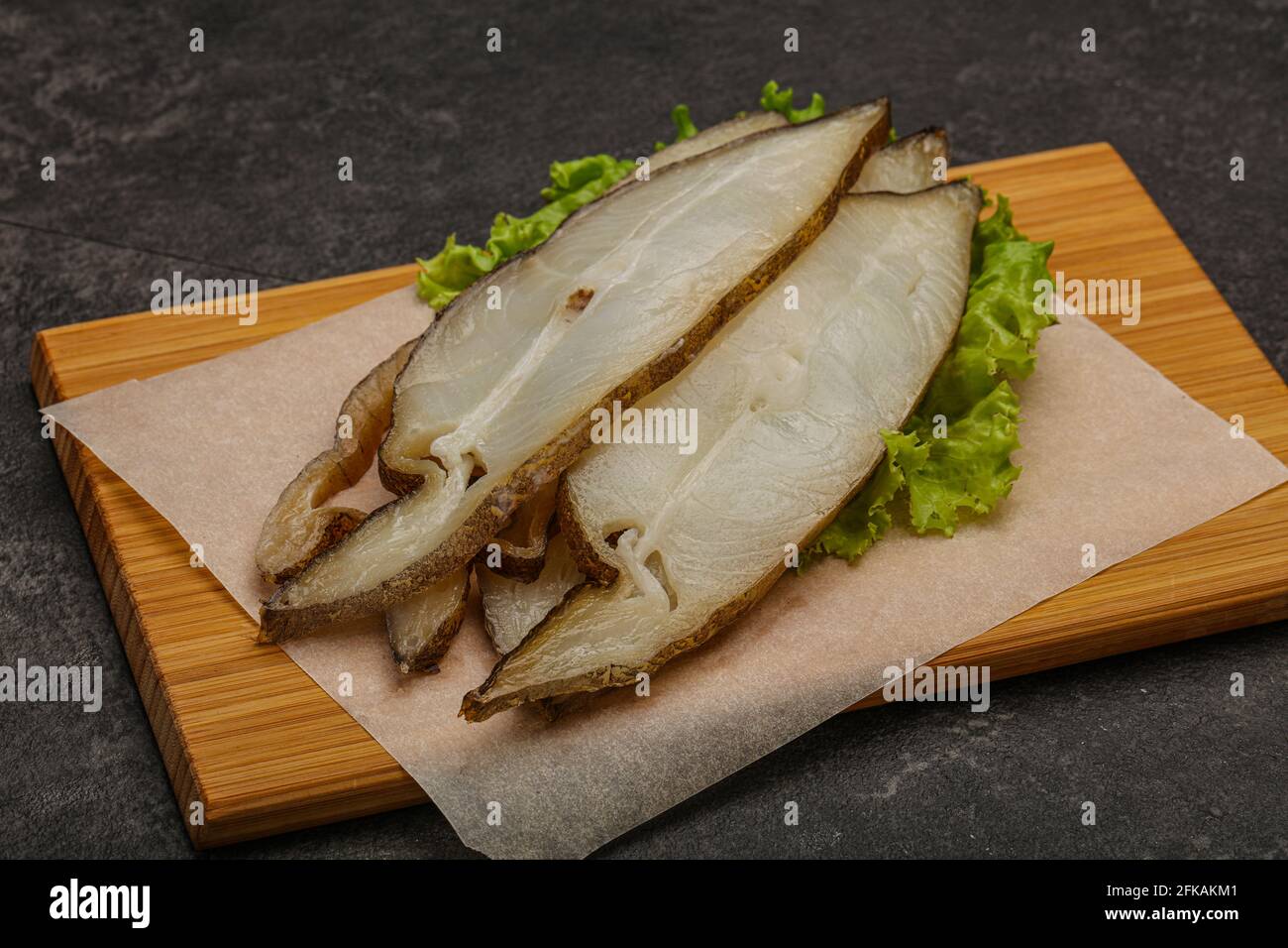 Delicous smoked halibut fish slices snack Stock Photo - Alamy