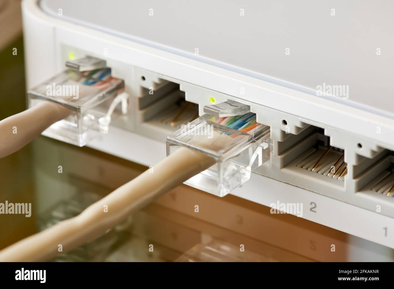 Ethernet cables connected to Desktop Switch or routerboard. Close-up ...