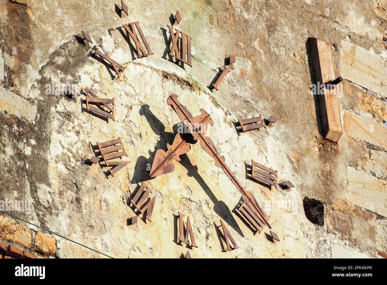 detail of an ancient medieval clock with Roman numerals - detail of a ...