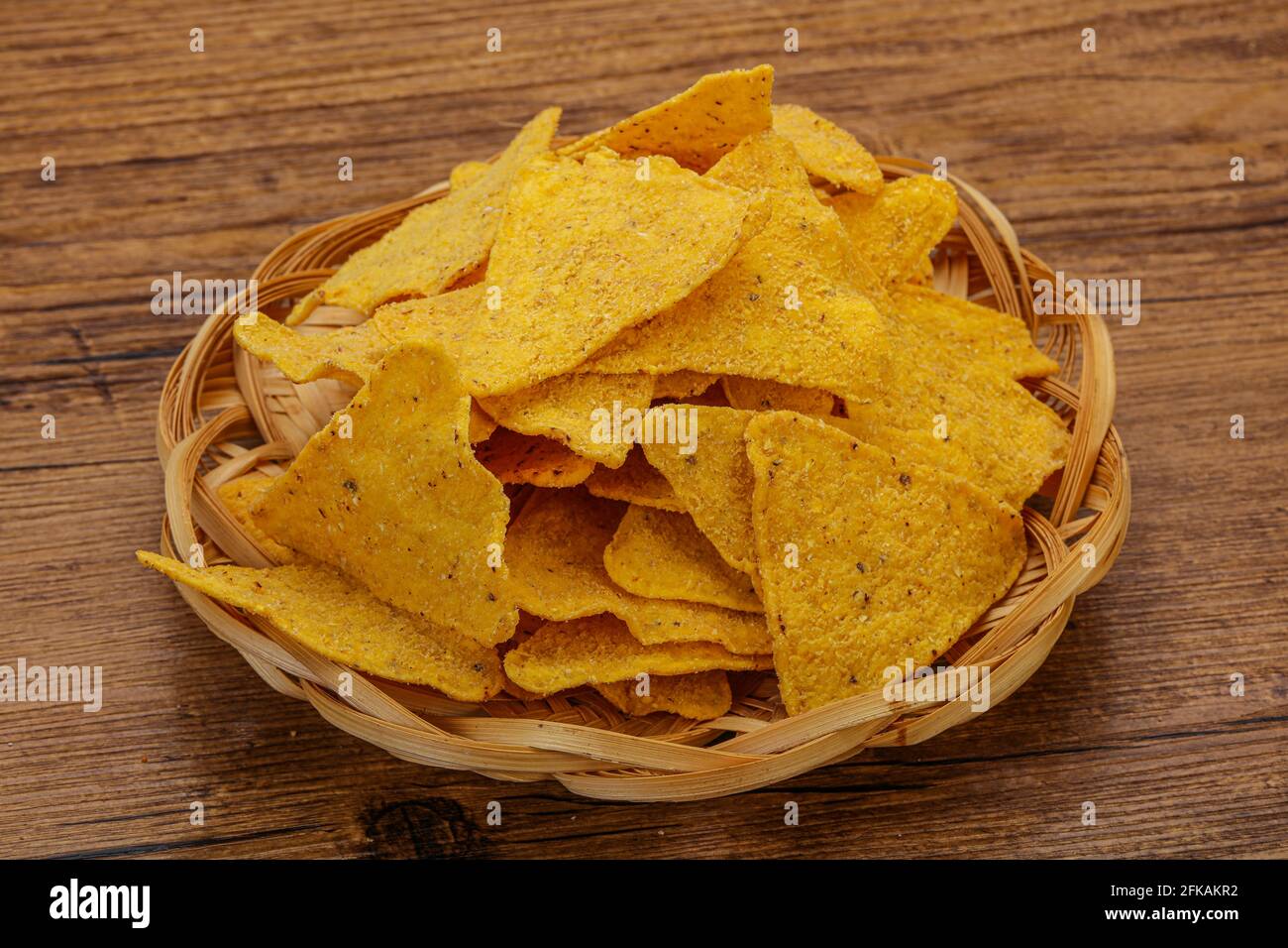 Mexican crunchy corn nachos triangle heap Stock Photo - Alamy