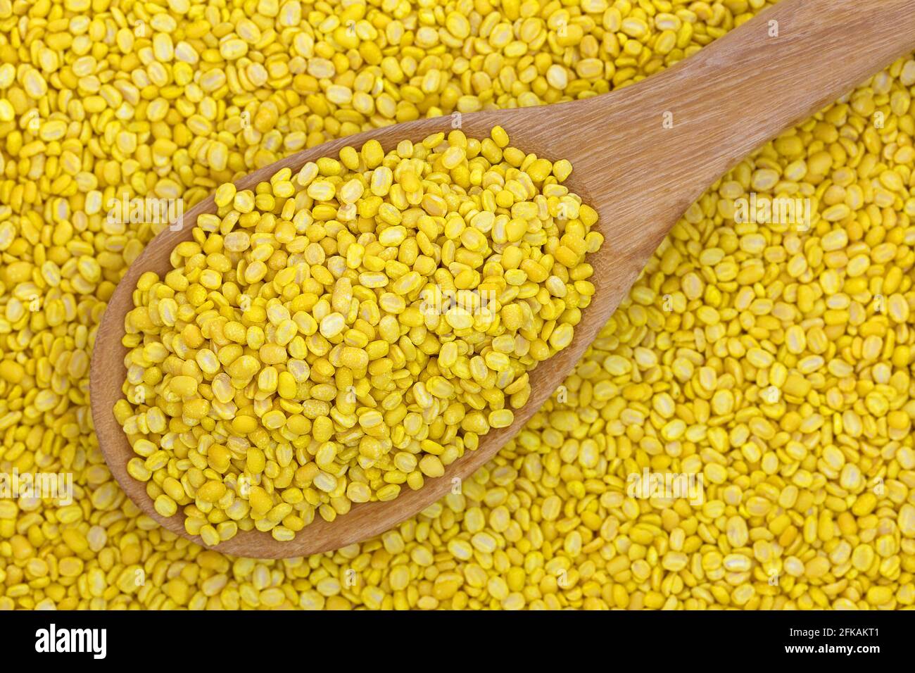 Closeup of dried Hulled and split mung bean in yellow without green ...