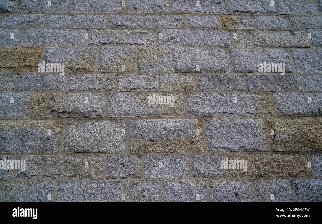 Wall made of natural stone built and grouted Stock Photo - Alamy