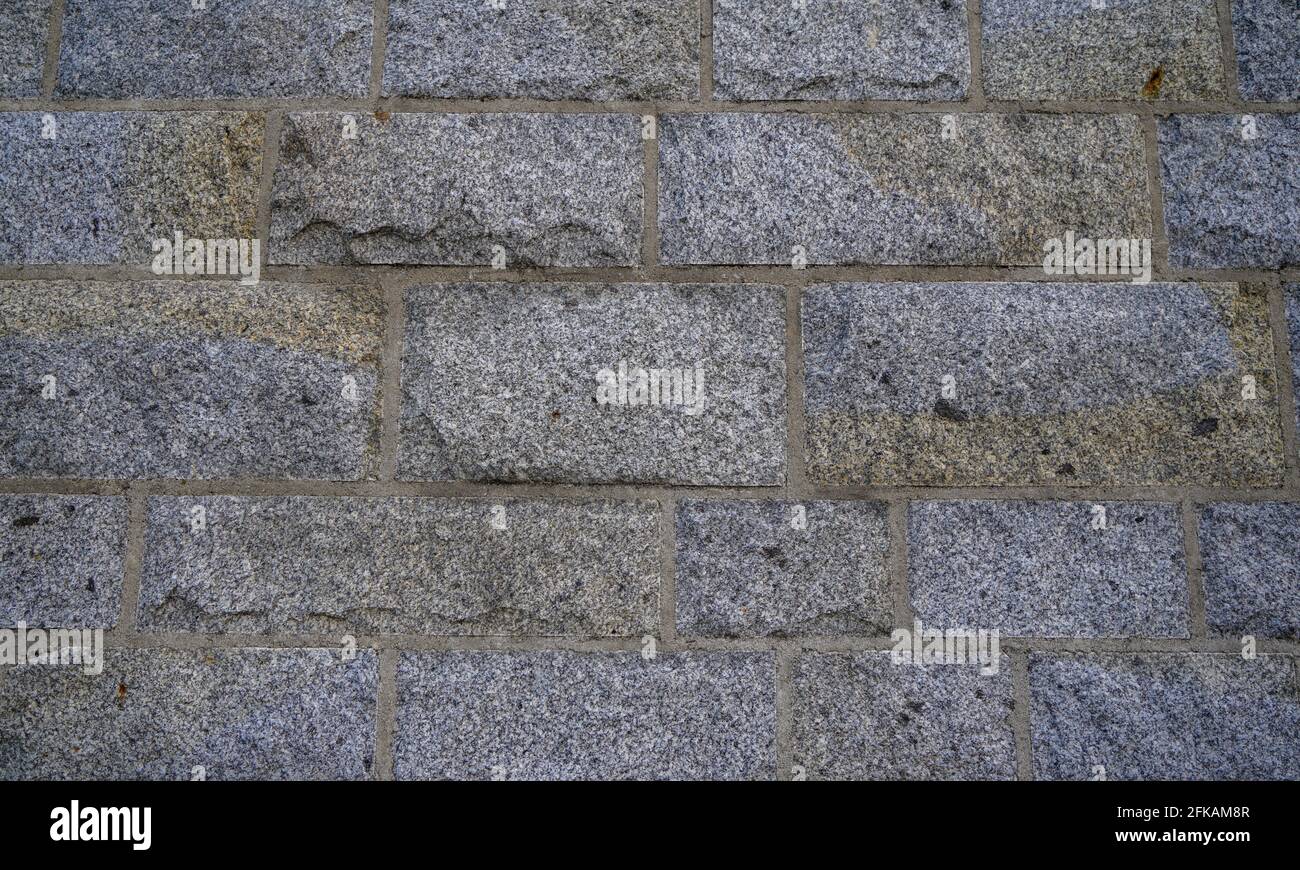Wall made of natural stone built and grouted Stock Photo - Alamy