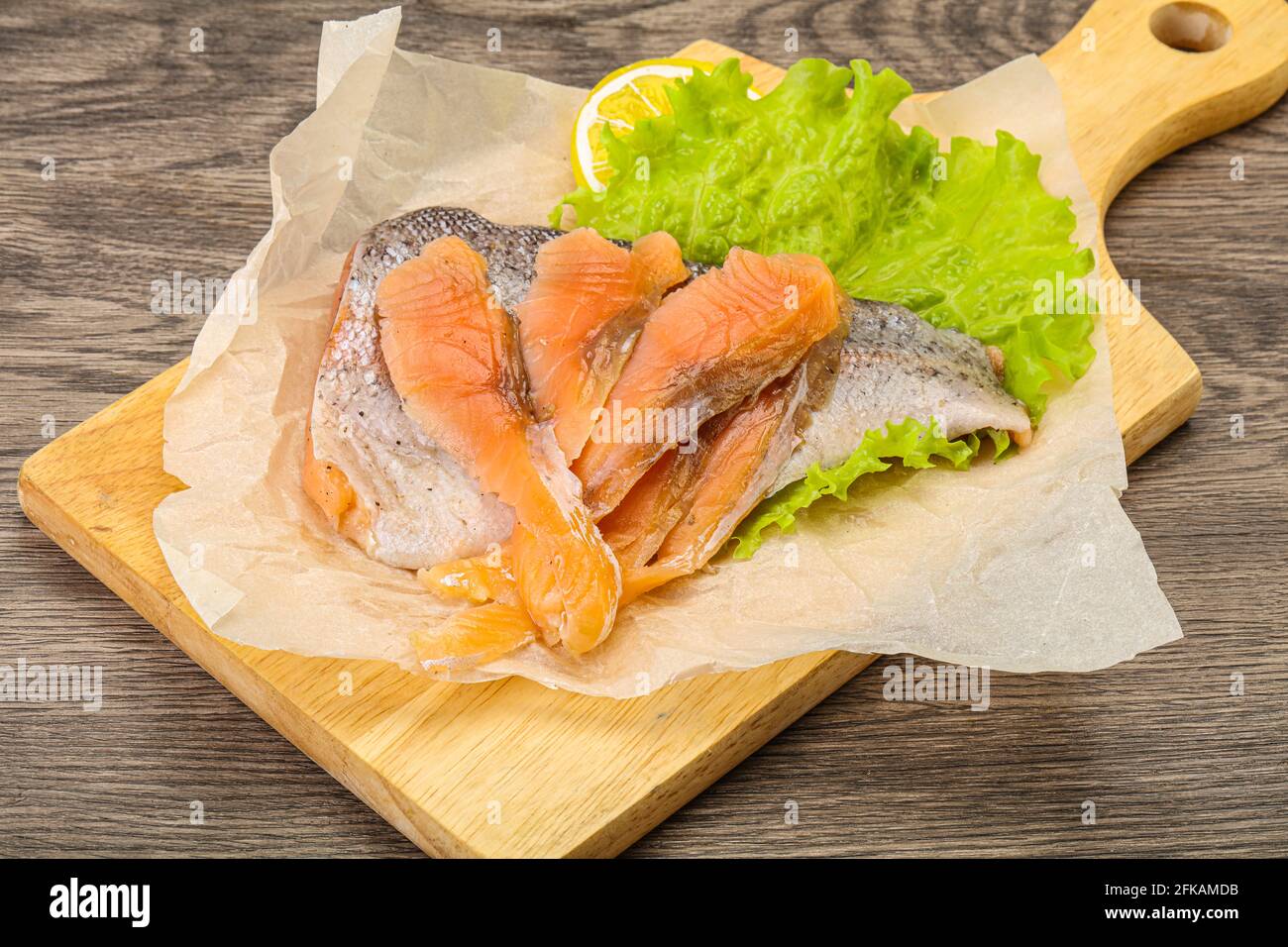 Sliced natural wild trout fillet over board Stock Photo - Alamy