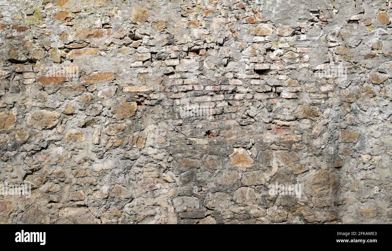 Wall made of natural stone built and grouted Stock Photo - Alamy