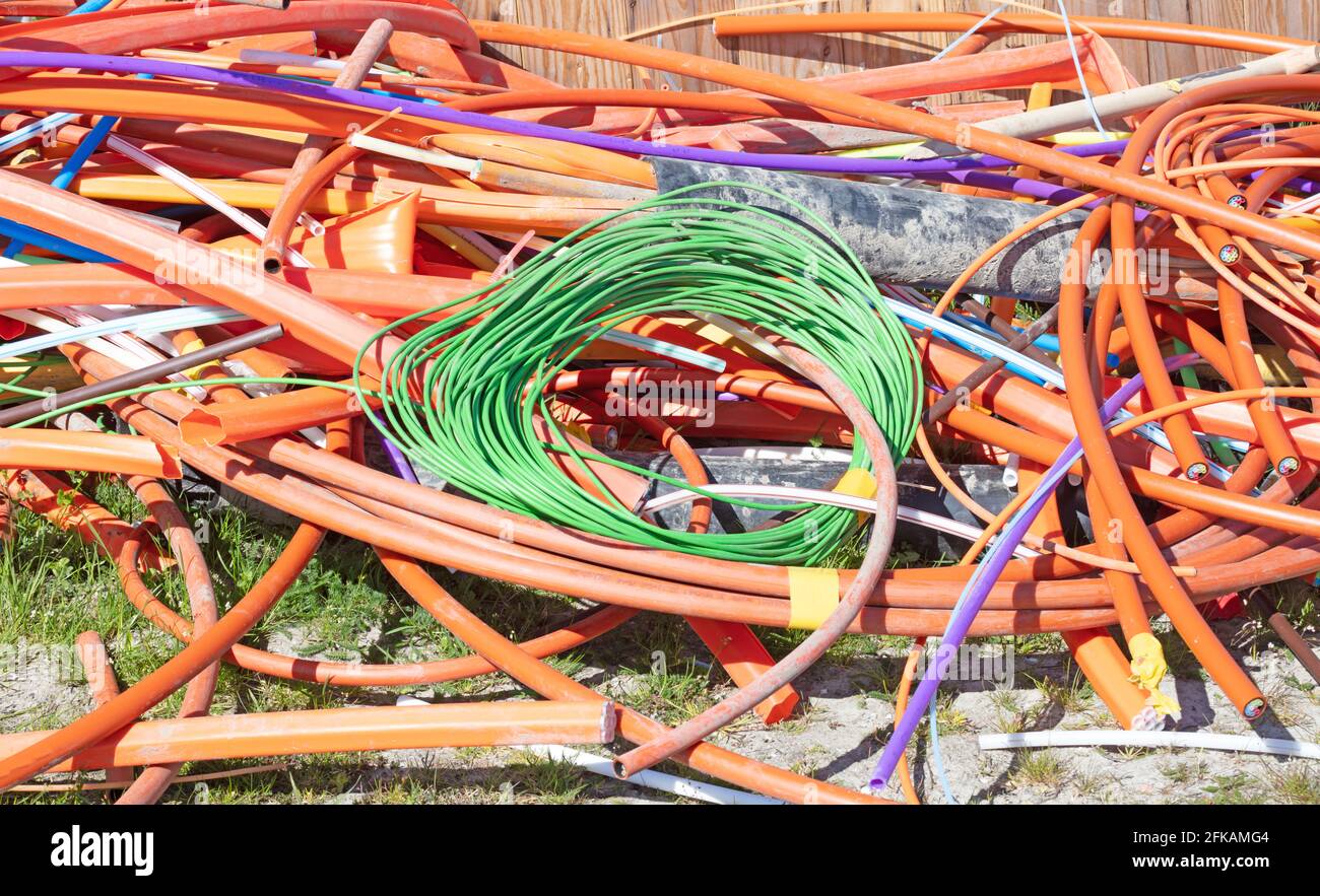 Pile of leftover cables, trash waiting to be picked up Stock Photo - Alamy