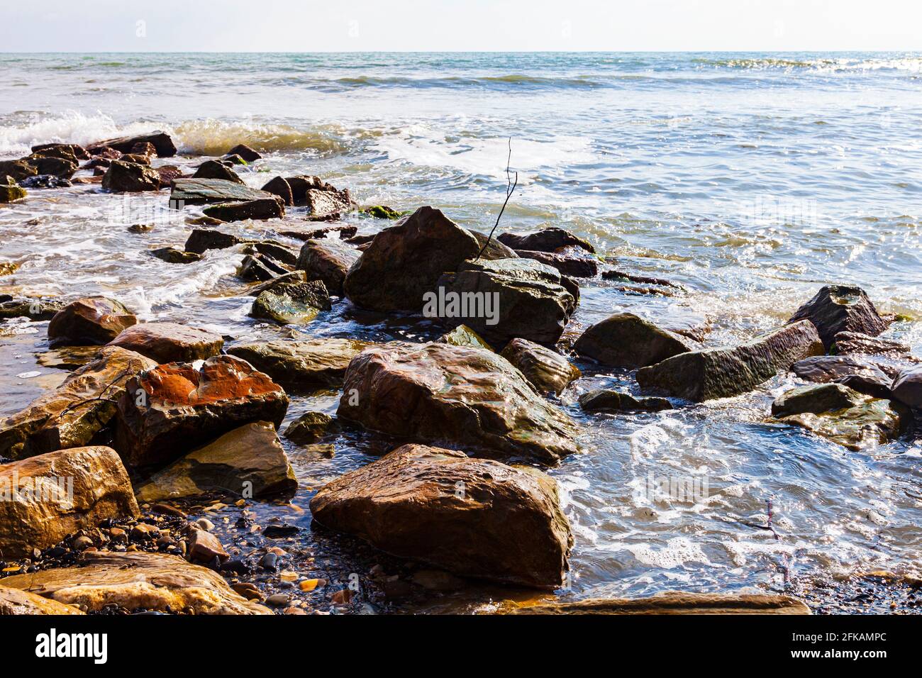 Beautiful seascape. Big rocks and surf Stock Photo - Alamy