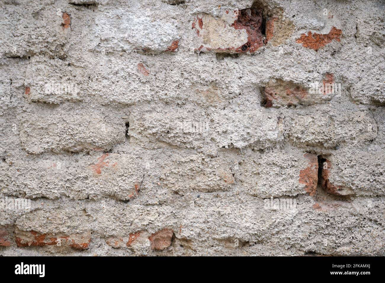 Wall made of natural stone built and grouted Stock Photo - Alamy