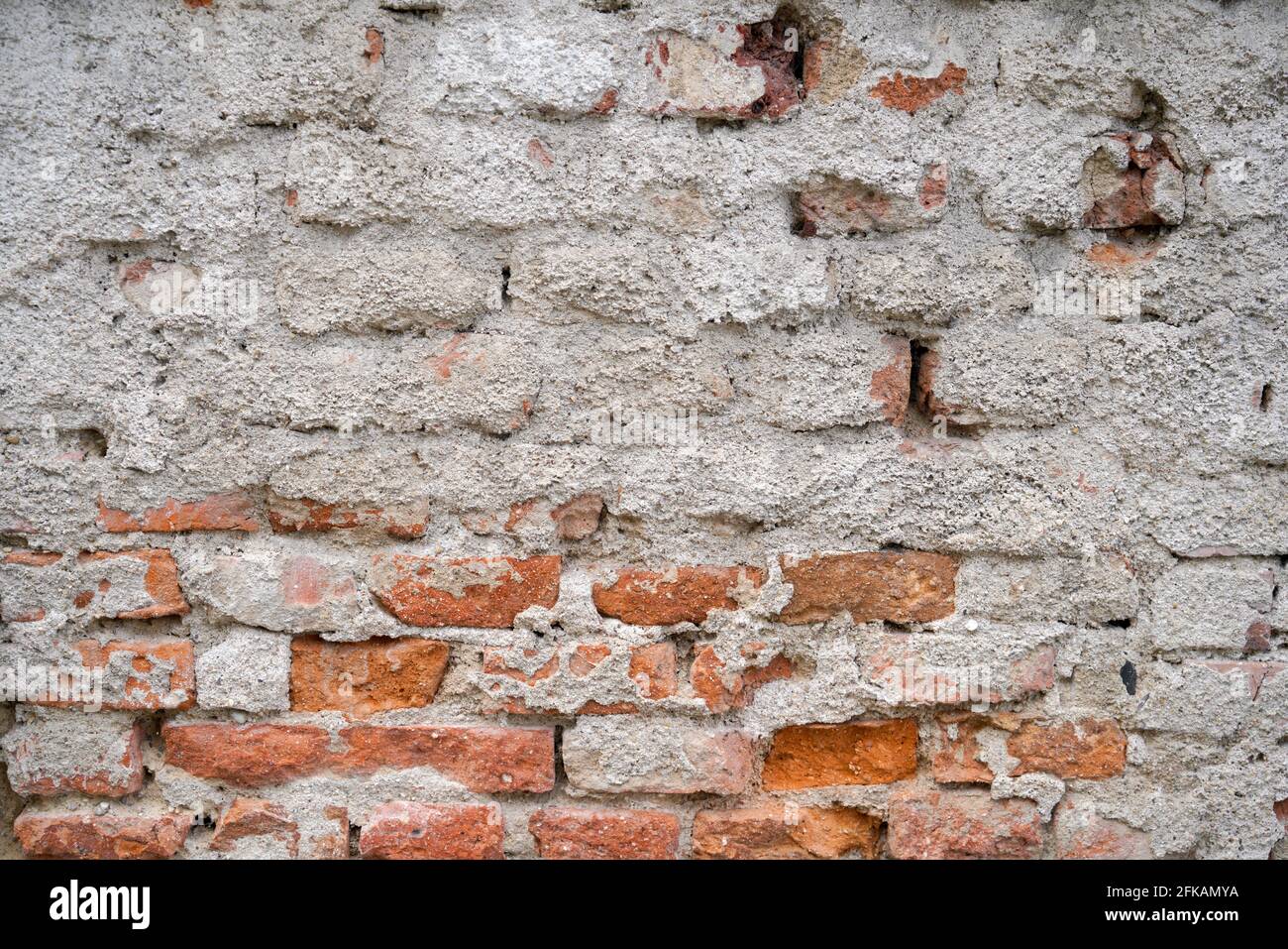 Wall made of natural stone built and grouted Stock Photo - Alamy