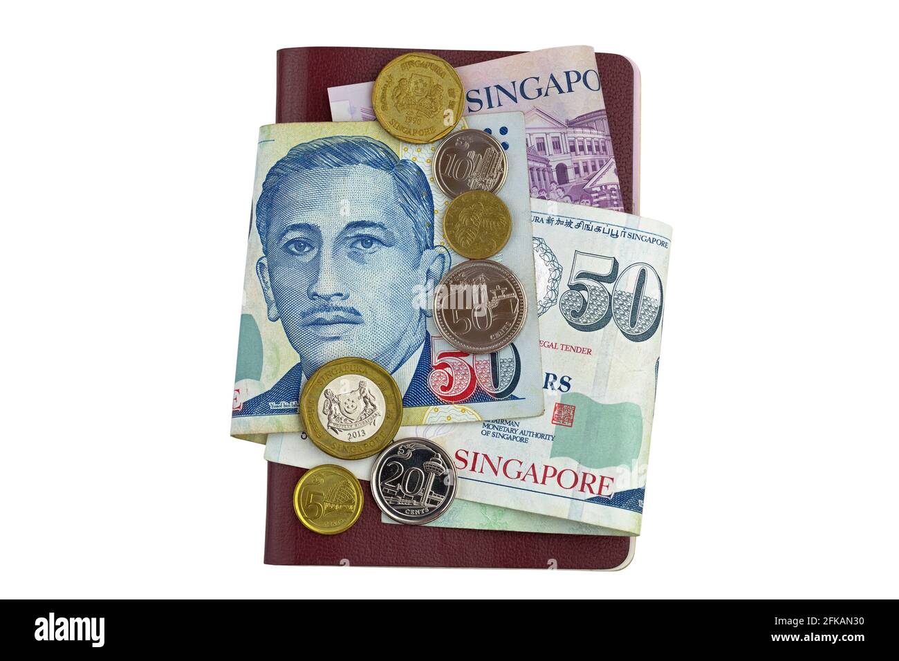 Singapore dollar banknote (SGD) and coins on red brown Passport ...