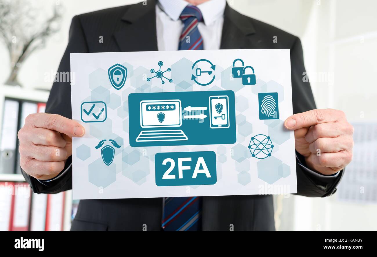 Paper showing 2fa concept held by a businessman Stock Photo - Alamy