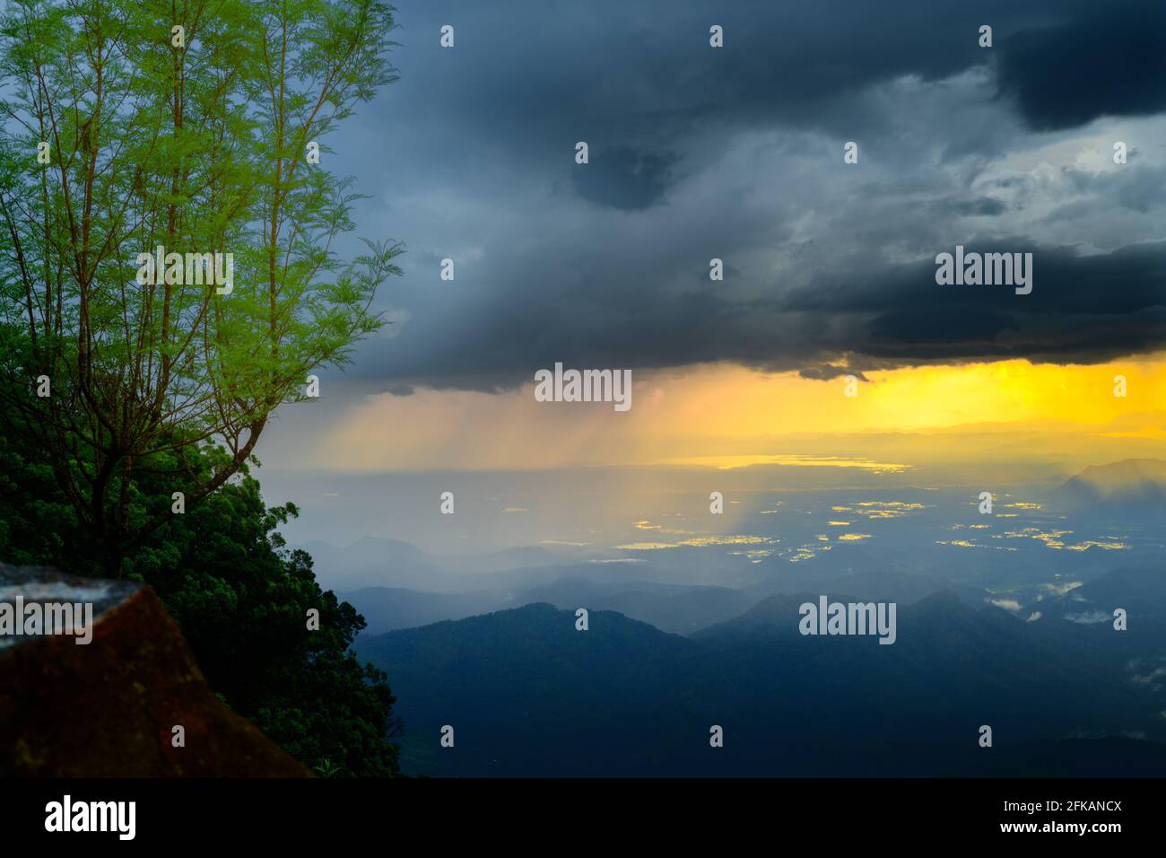 Rain and the dark clouds in the distance view from a mountain top ...