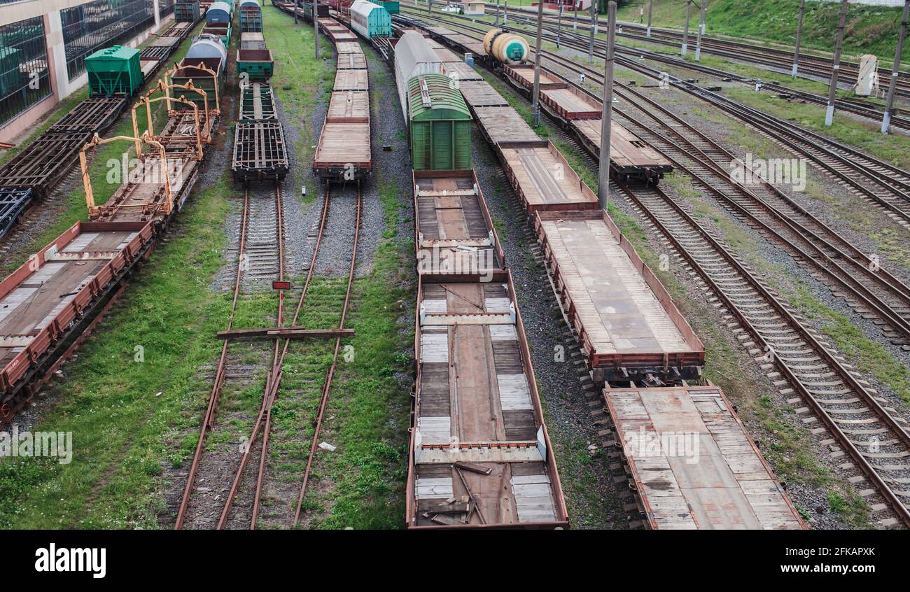 View of the rails and freight trains. Railway station Stock Photo - Alamy