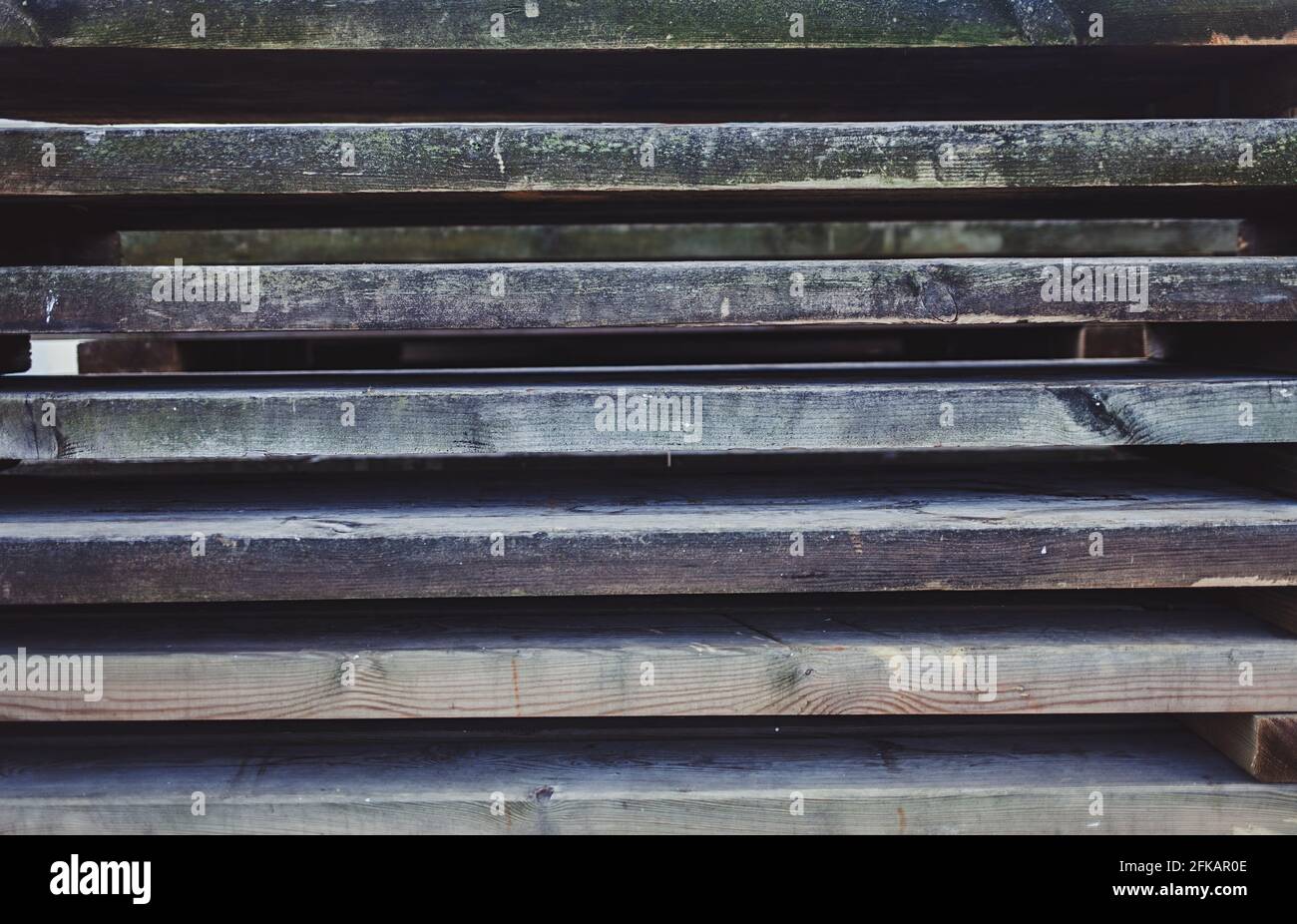 Stack of old wooden materials. background and texture Stock Photo - Alamy