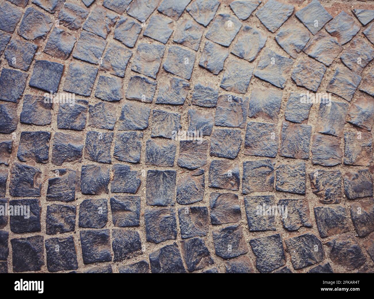 Dirty paving stones in the city. Road from paving stones for background ...