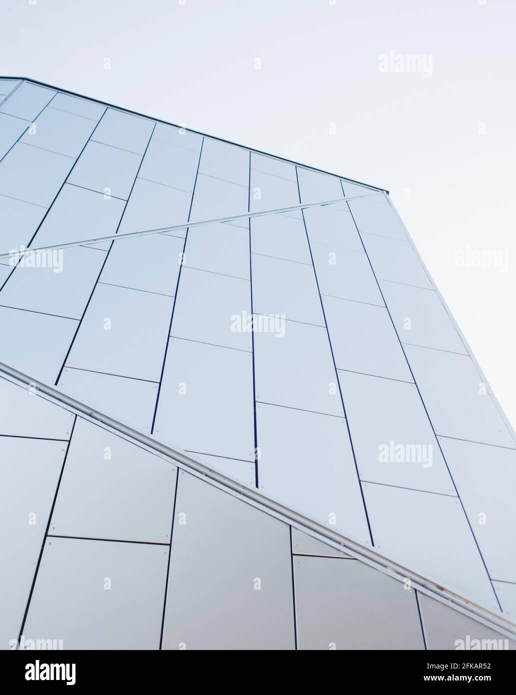 Modern architectural details. Metallic silver facade on sky background ...