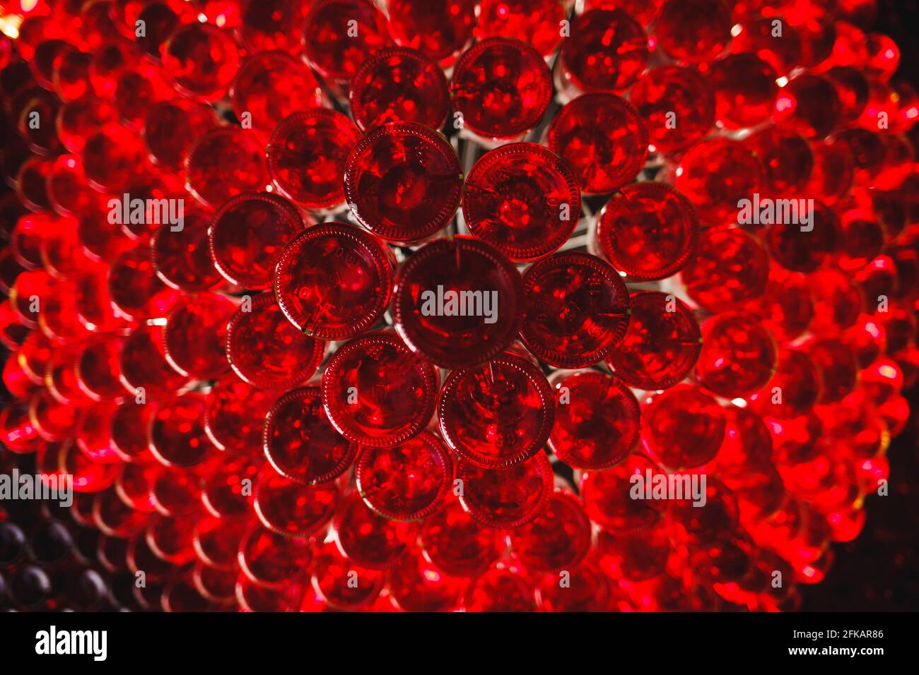 many red bottoms of wine bottles in the interior of the restaurant ...