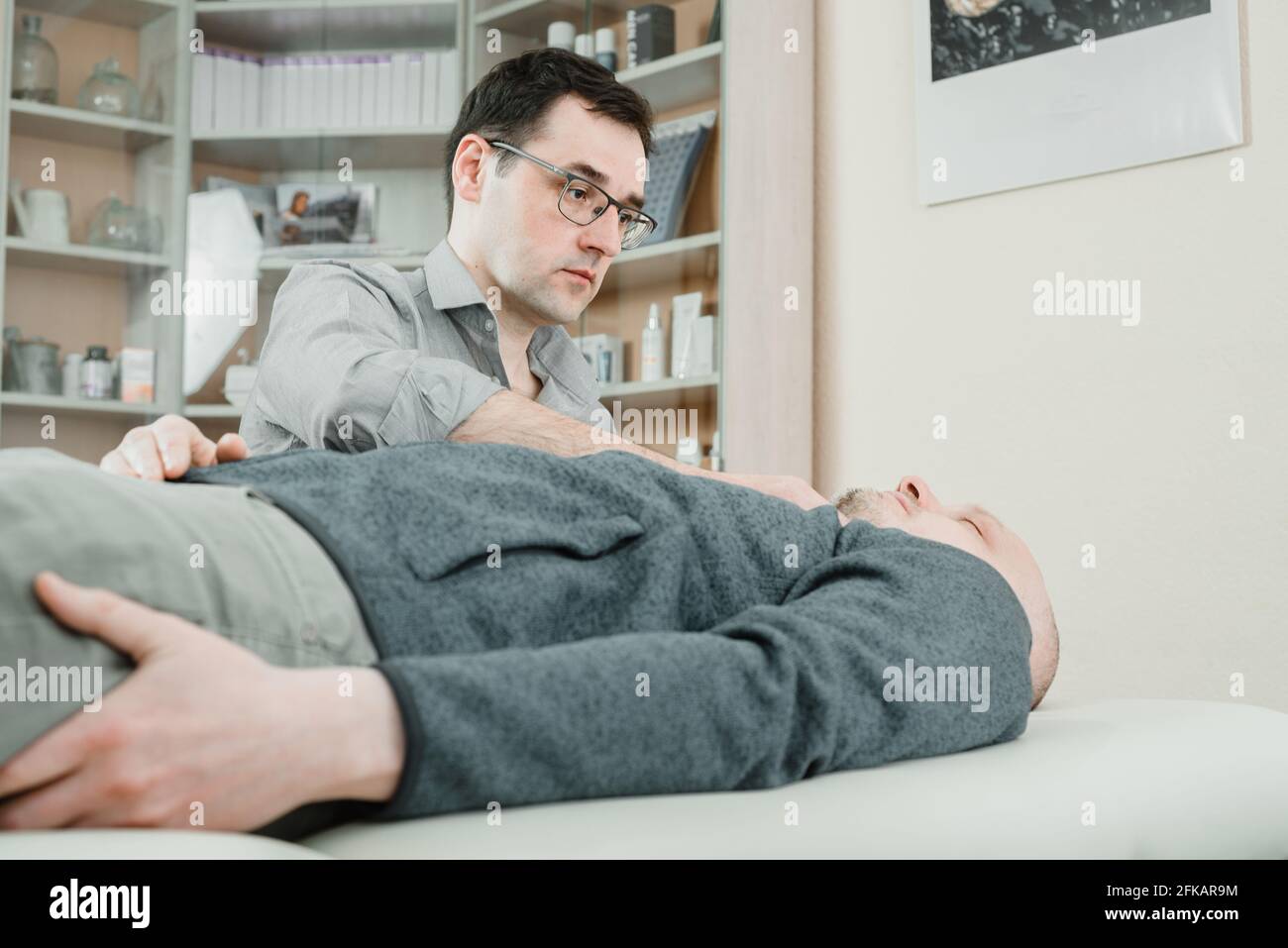 CST practiitioner uses gentle pressure to relieve the stress and pain ...